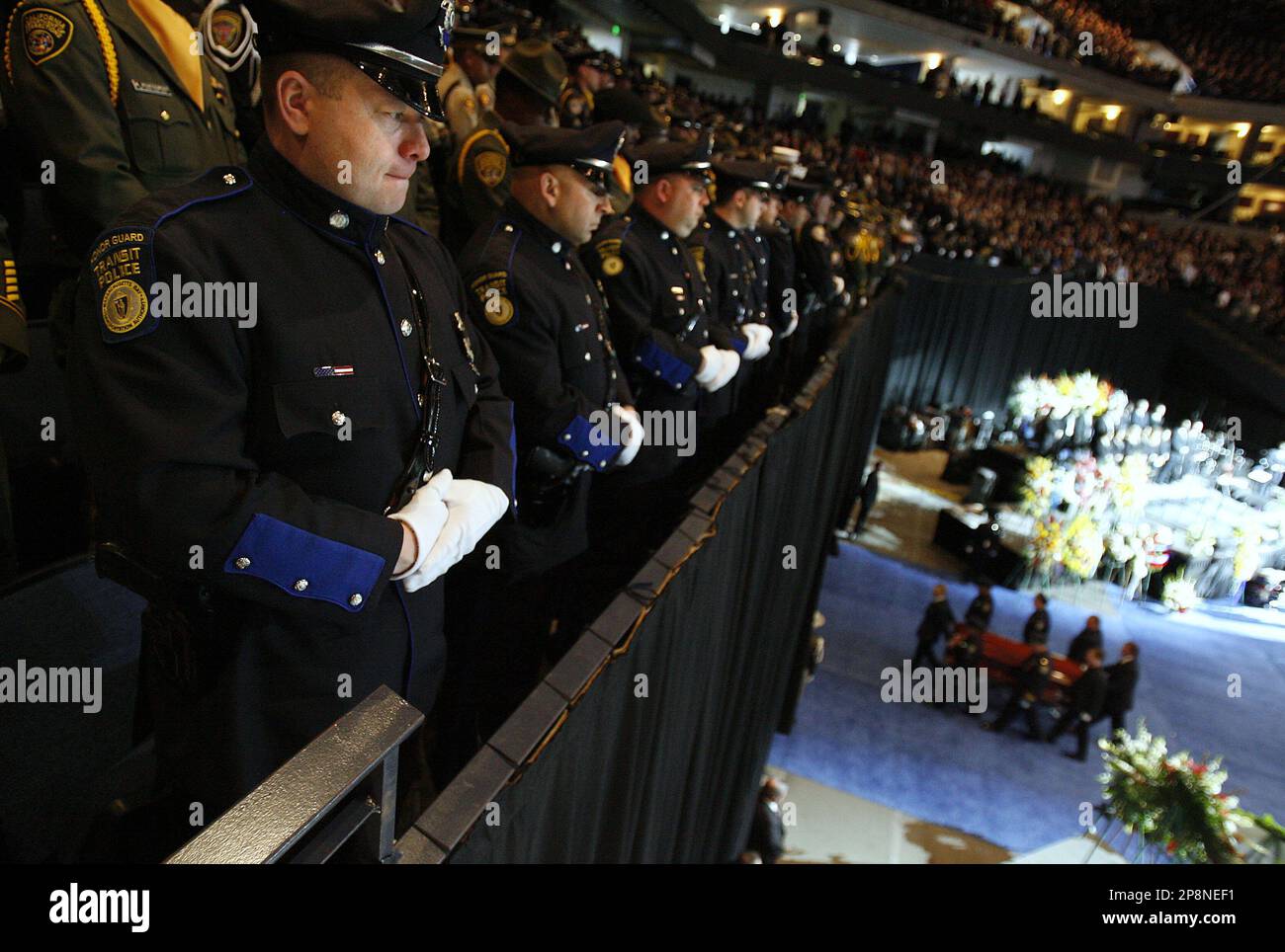 Massachusetts Transit police officer Steve O'Hara, left, stands at ...