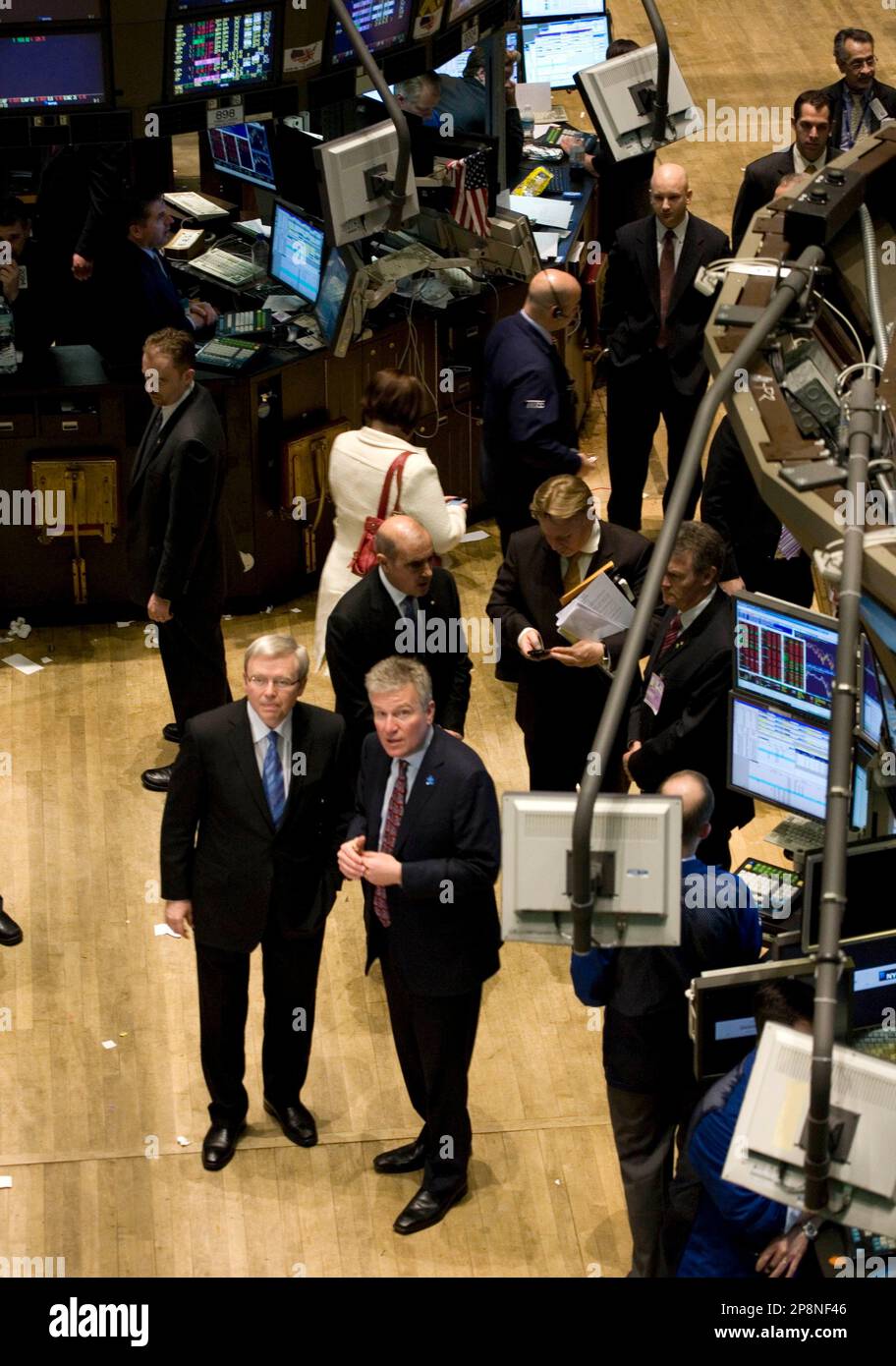 Australian Prime Minister Kevin Rudd, left, and New York Stock Exchange ...