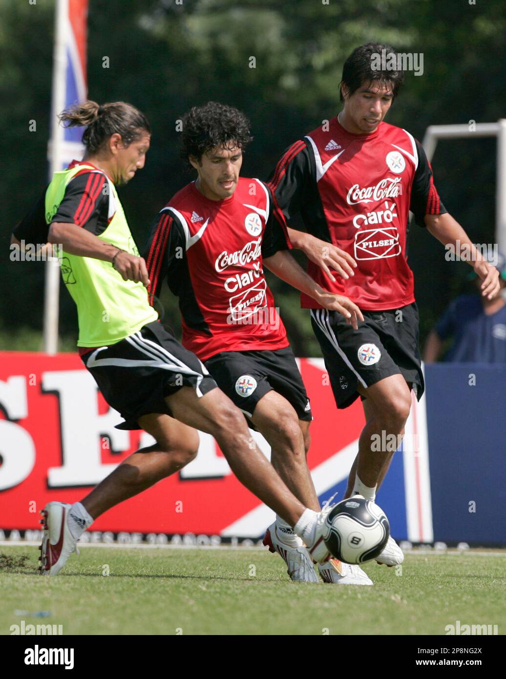 Paraguay's soccer players Enrique Vera, left, Cristhian Riveros, center ...
