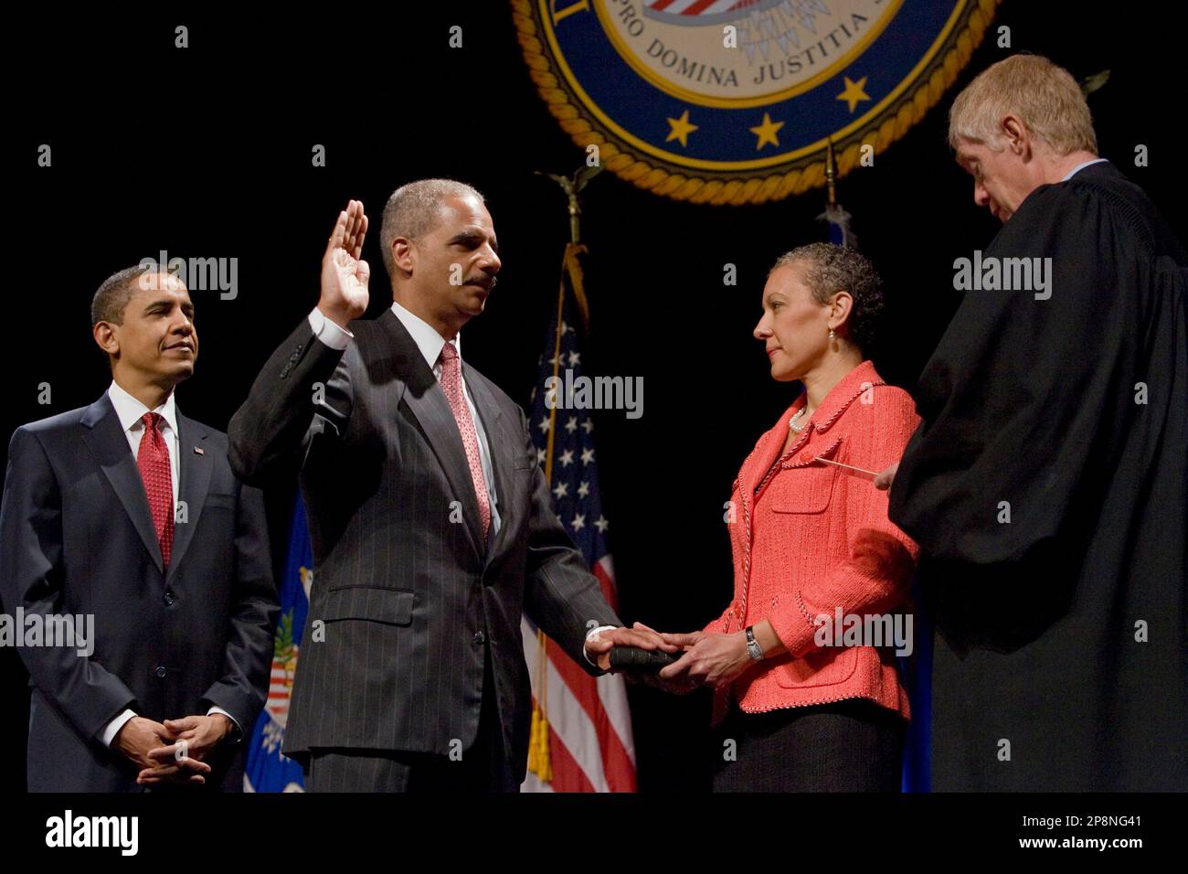 President Barack Obama, left, looks during the installation ceremony ...