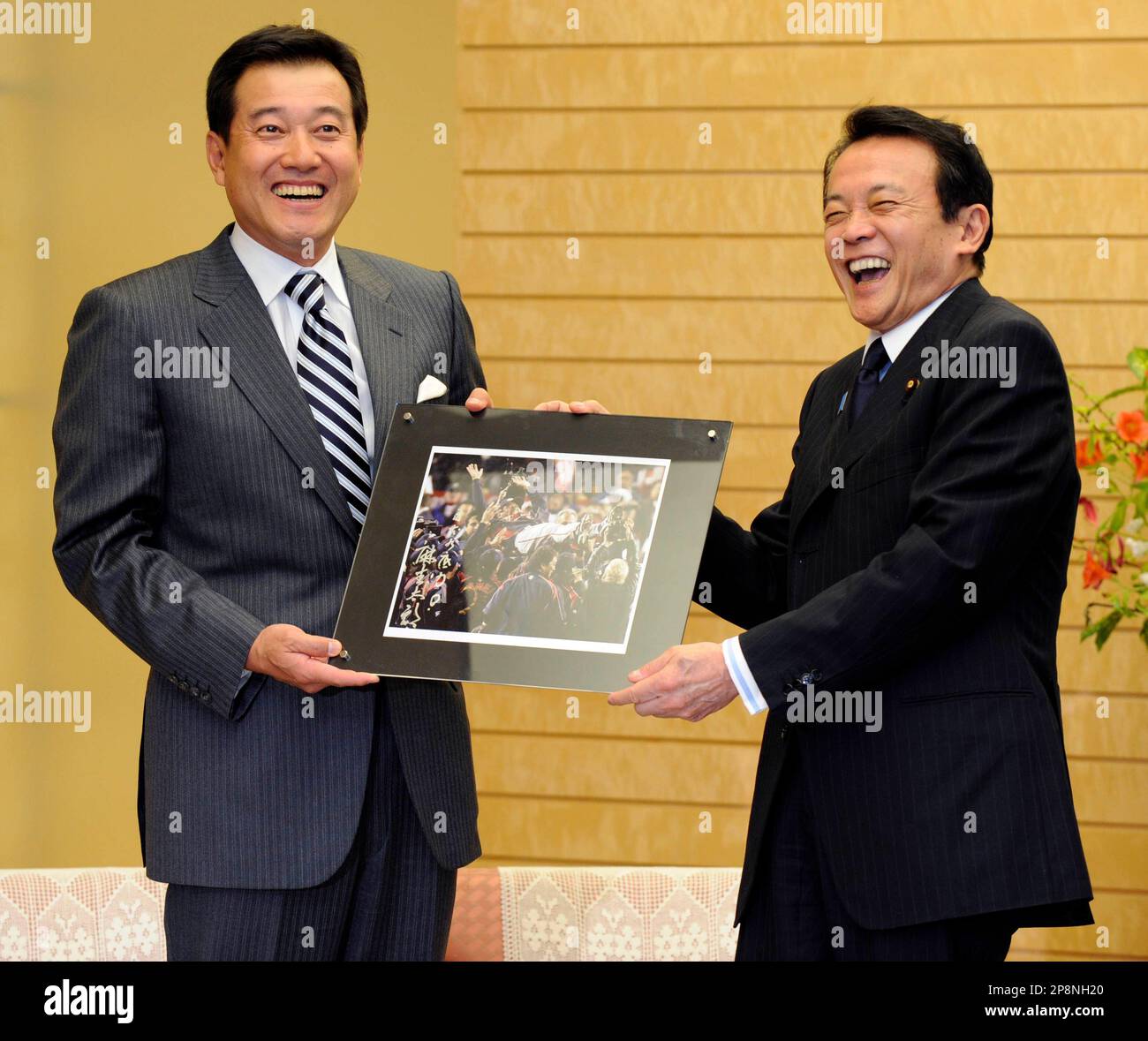 Team Japan manager Tatsunori Hara, left, shares a laugh with Japanese ...