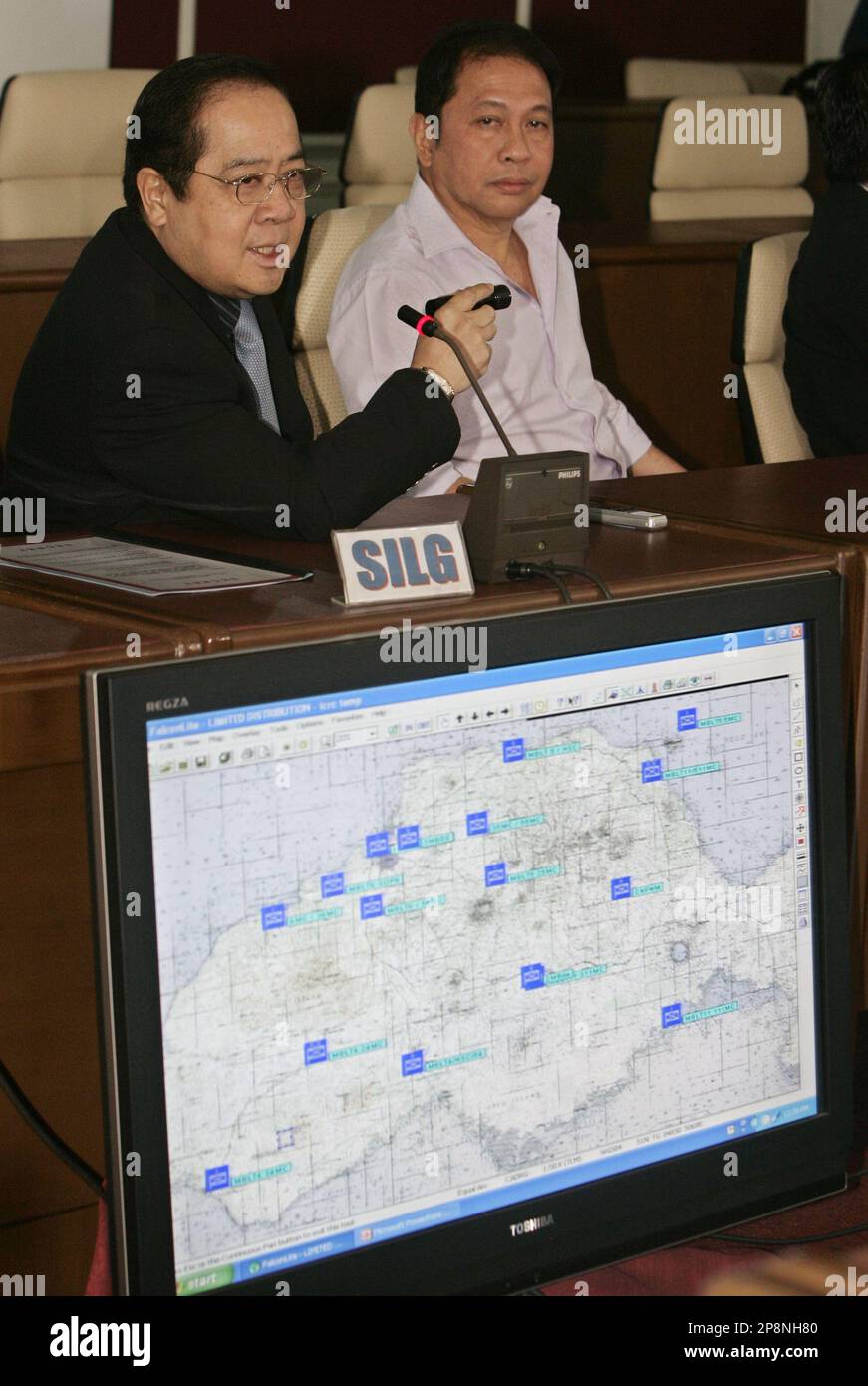 Philippine Interior and Local Government Secretary Ronaldo Puno, left ...