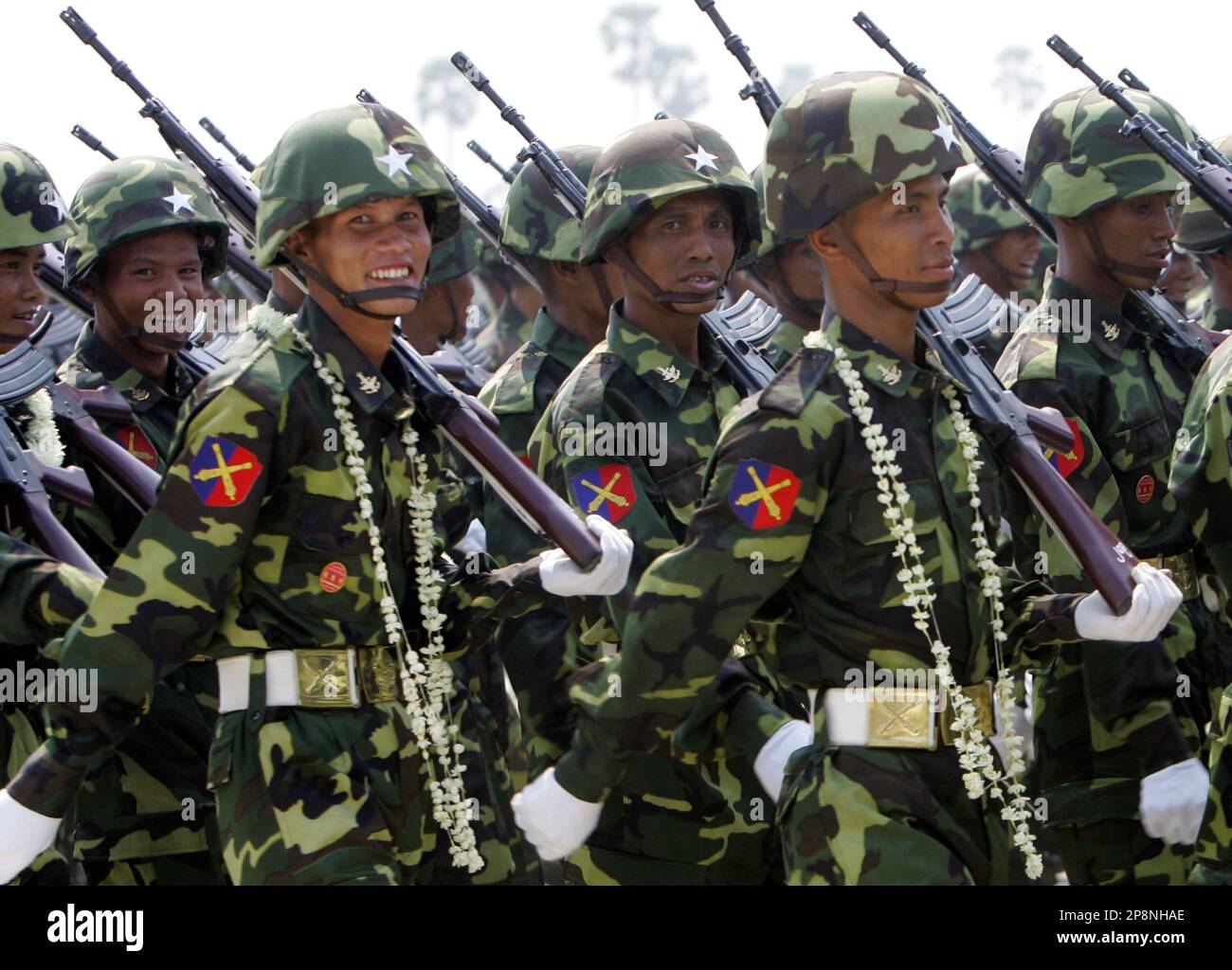 Myanmar's soldiers march during the 64th anniversary Armed Forces Day ...