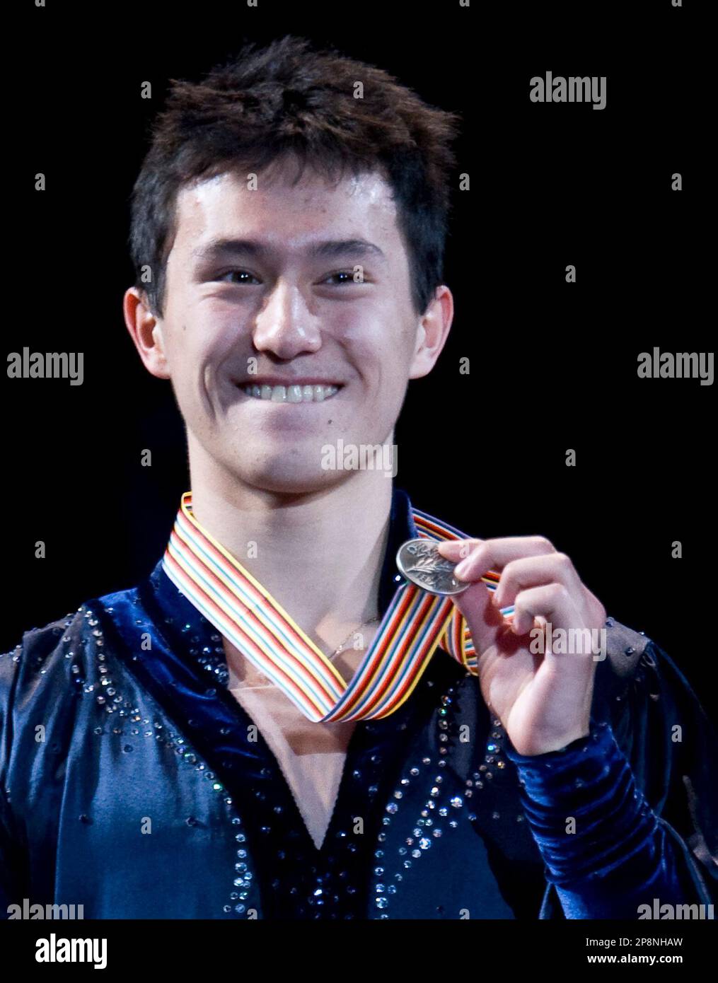Men's silver medalist Canada's Patrick Chan from Toronto shows off his ...