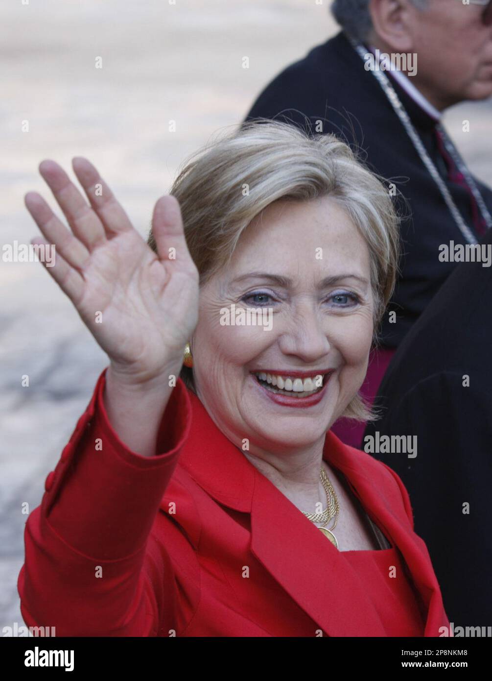 US Secretary of State Hillary Rodham Clinton waves to people during a ...