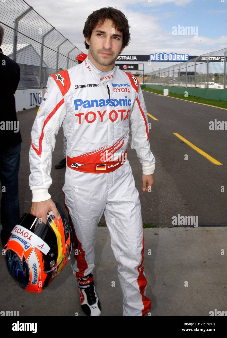 Toyota Formula One driver Timo Glock of Germany walks through the pit ...