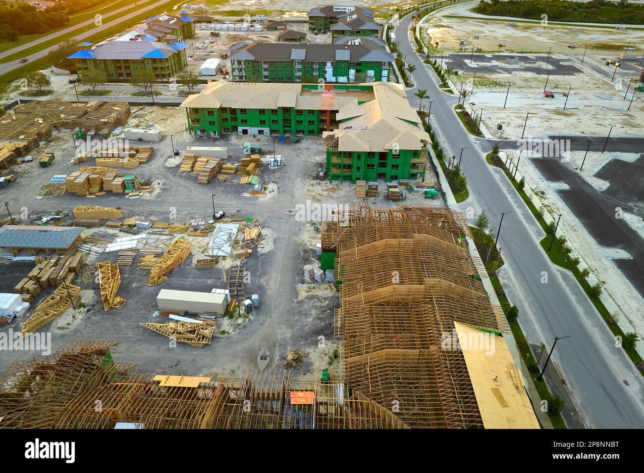 View from above of unfinished frame of apartment condos with wooden ...
