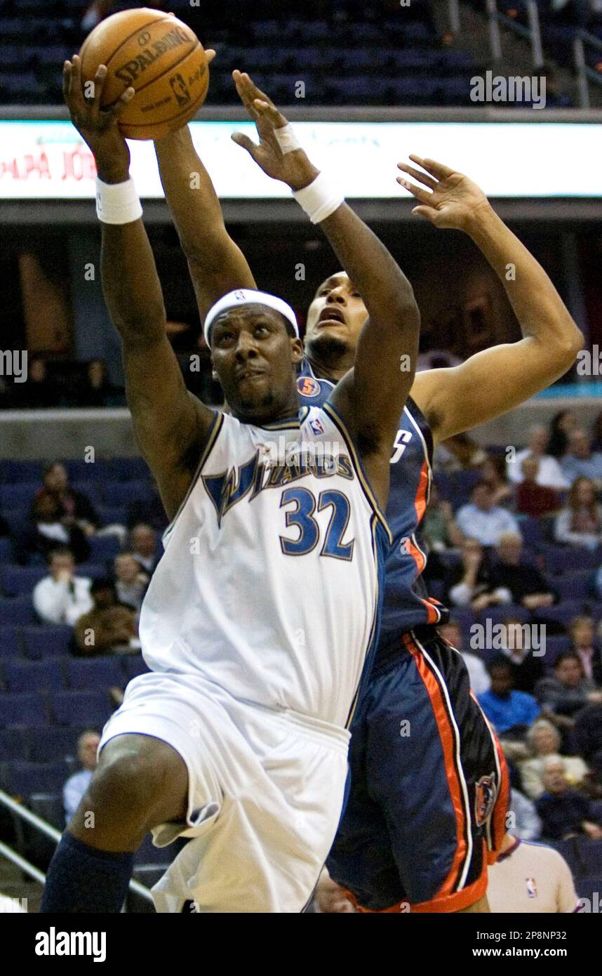 Washington Wizards' Andre Blatche (32) shoots past Charlotte Bobcats ...