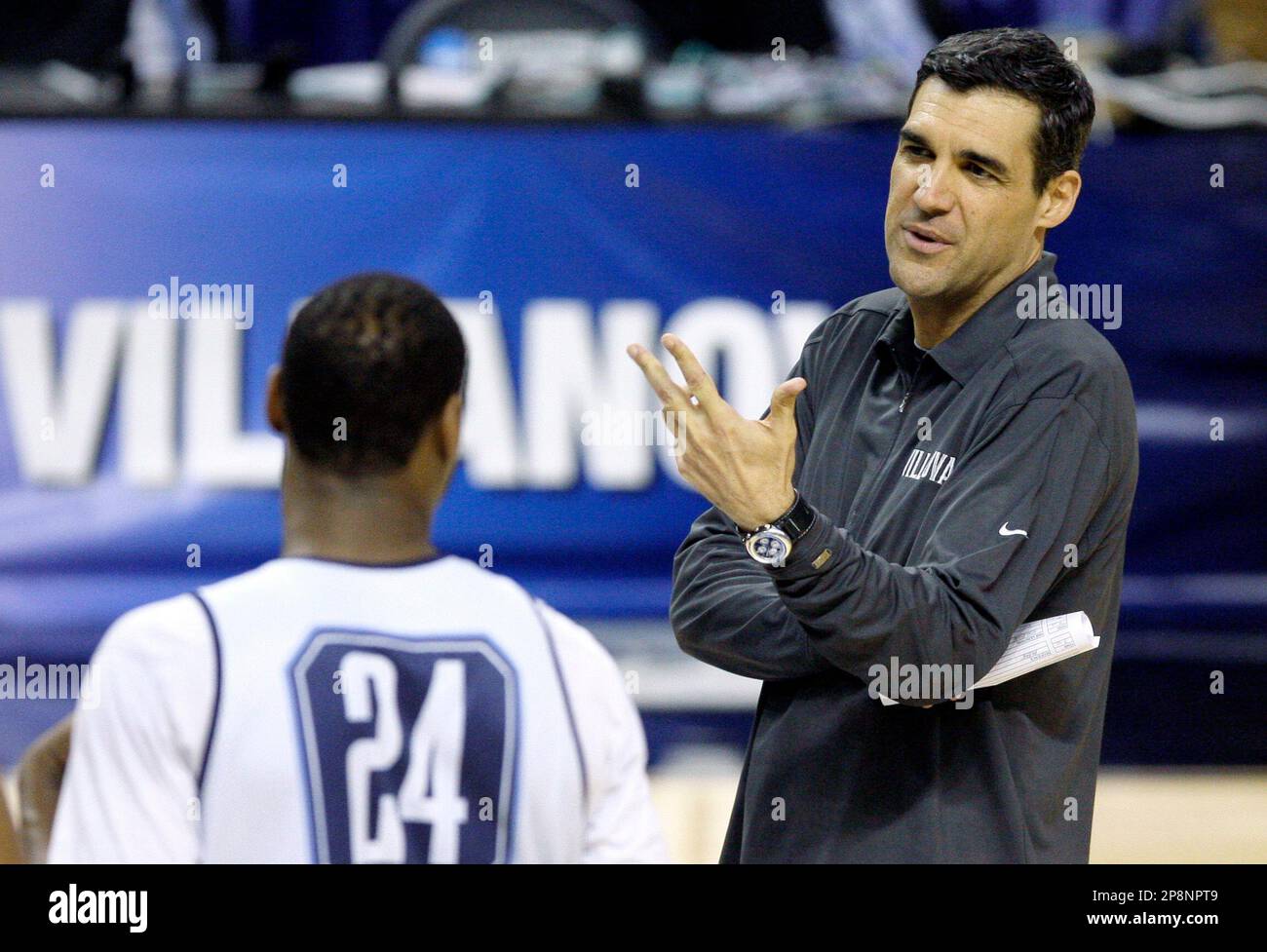 Villanova head coach Jay Wright, right, talks to guard Corey Stokes (24 ...