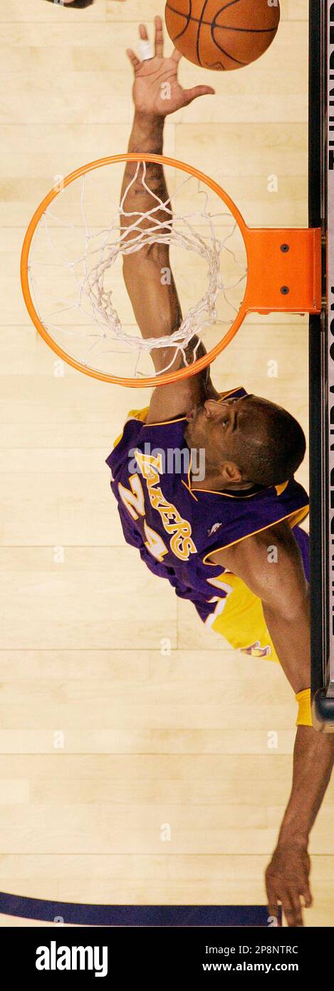 Los Angeles Lakers guard Kobe Bryant reaches for a rebound in the third ...