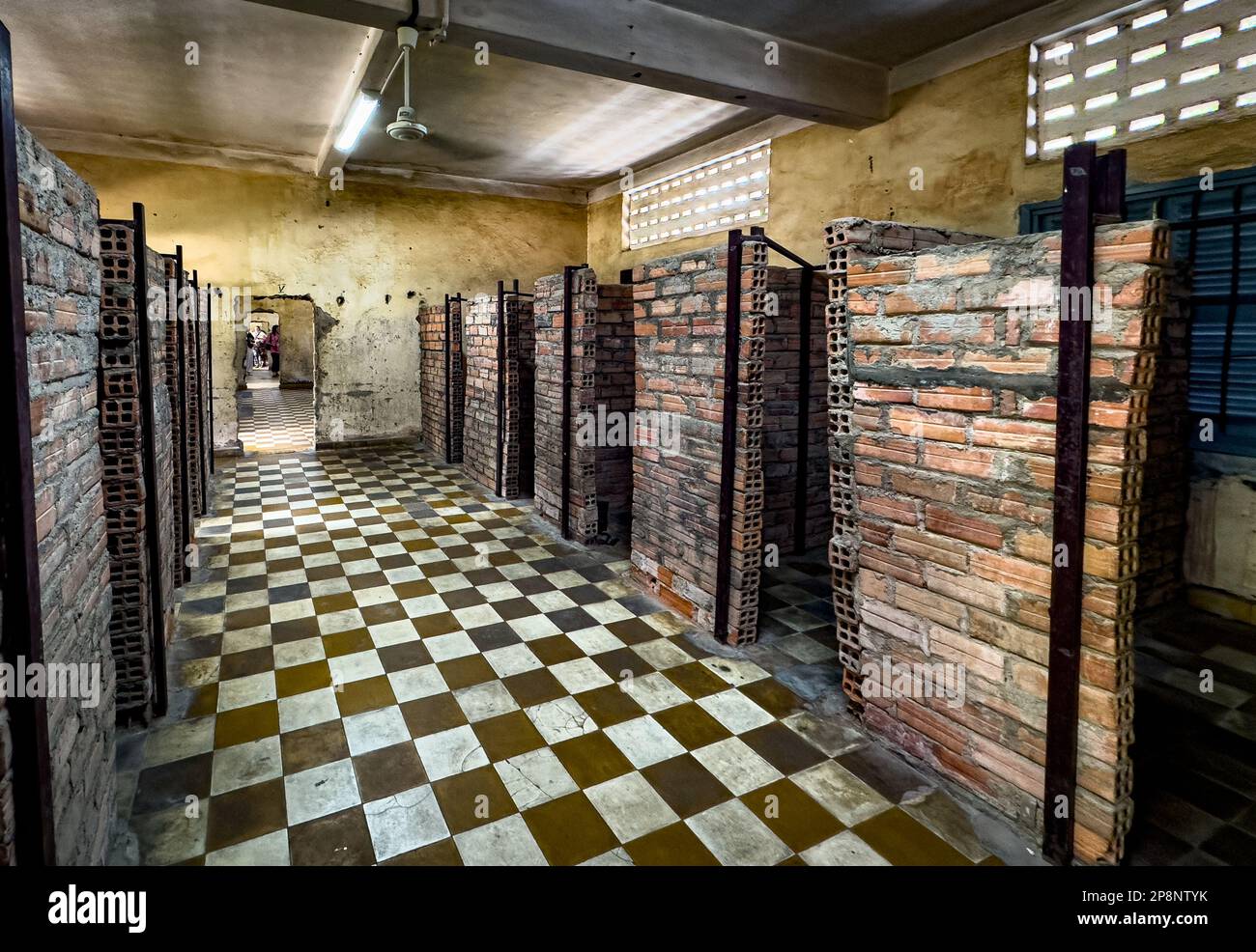 Rough built cells and doorways punched through concrete walls linking ...