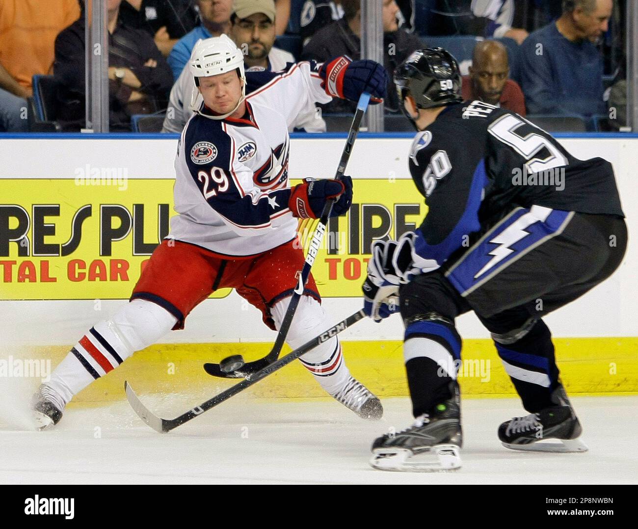 Columbus Blue Jackets' Jason Williams (29) flips the puck past Tampa ...