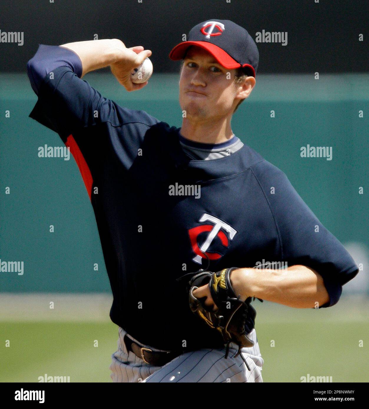Minnesota Twins starting pitcher Kevin Slowey takes a warm-up toss ...
