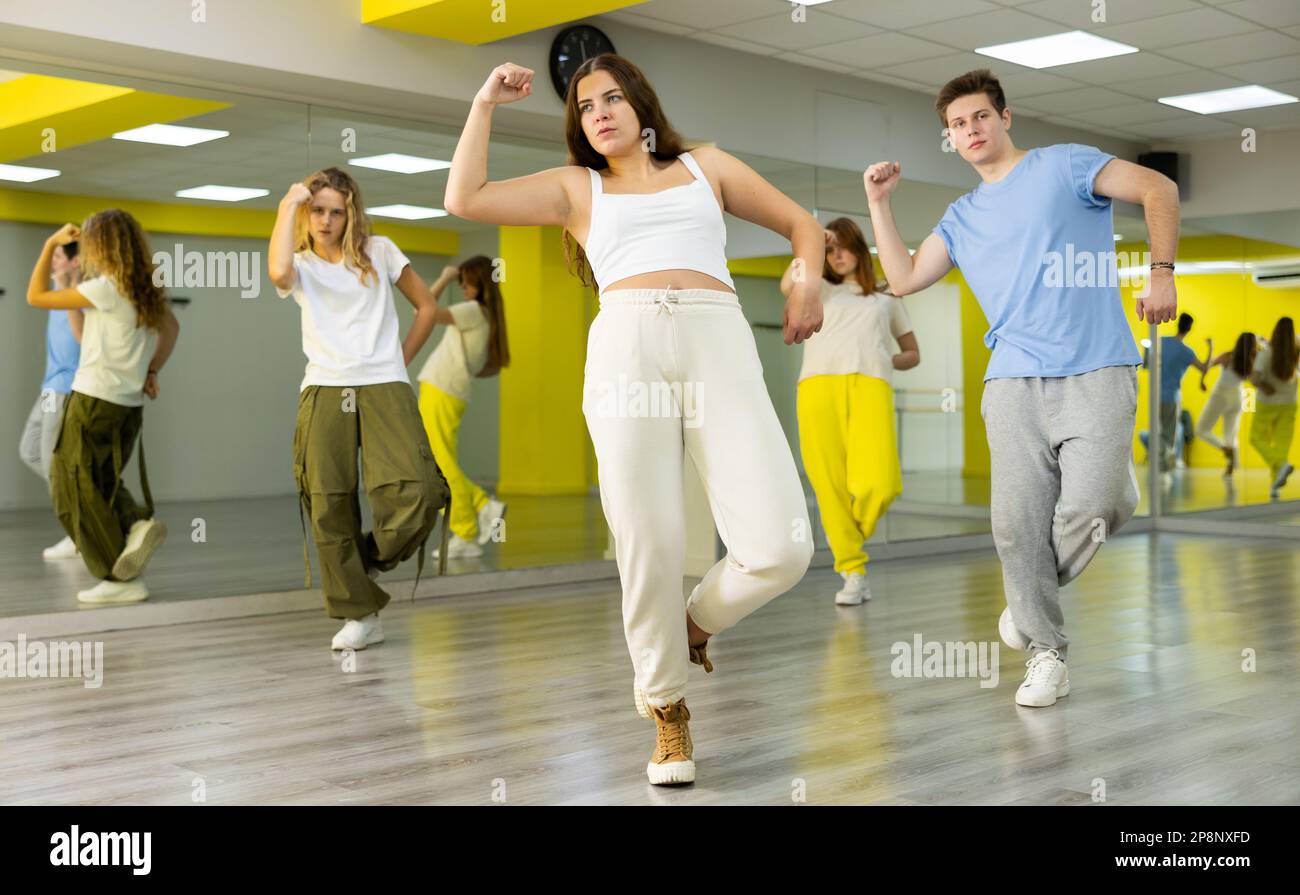 Dancer boys and girls showing different tricks and movements while ...