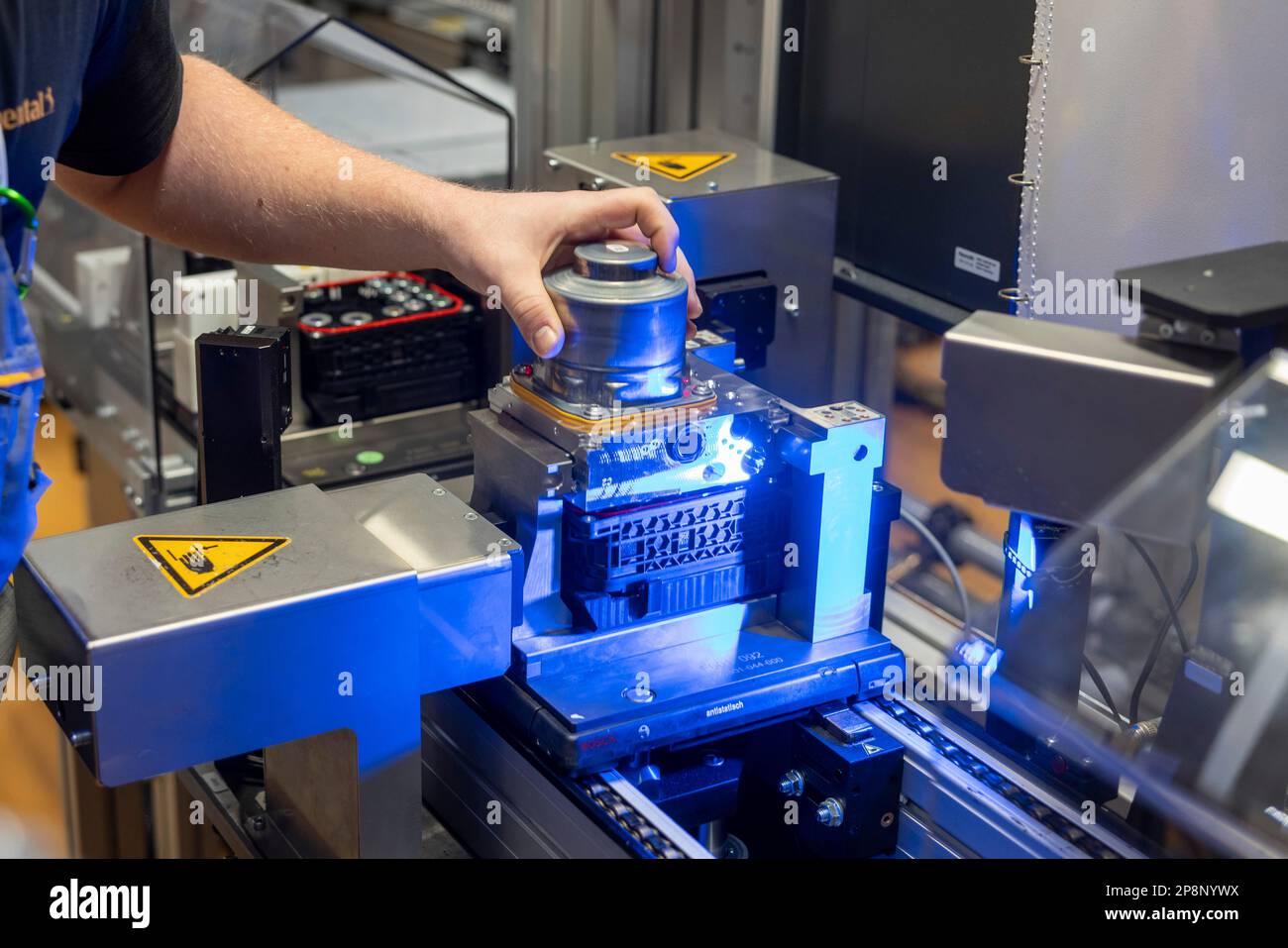 03 March 2023, Hesse, Frankfurt/Main: A Continental employee checks a ...