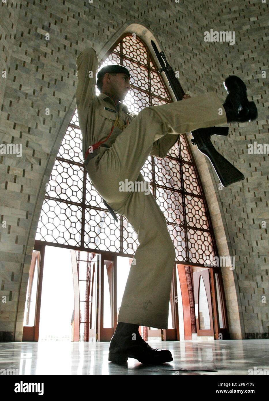 A Pakistani army officer takes over a guard duty at Mausoleum of ...