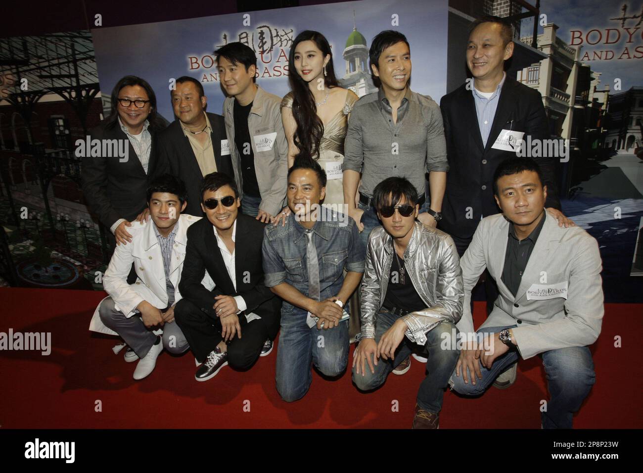 Casts and staff of film "Bodyguards and Assassins" pose together during ...