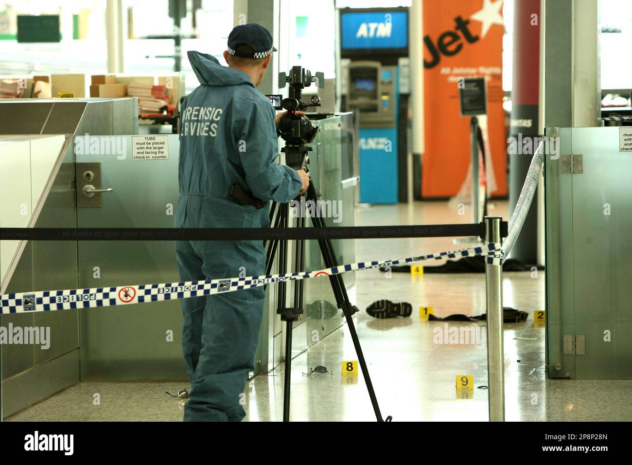 A police works at a scene of a brawl by suspected rival biker gangs is ...