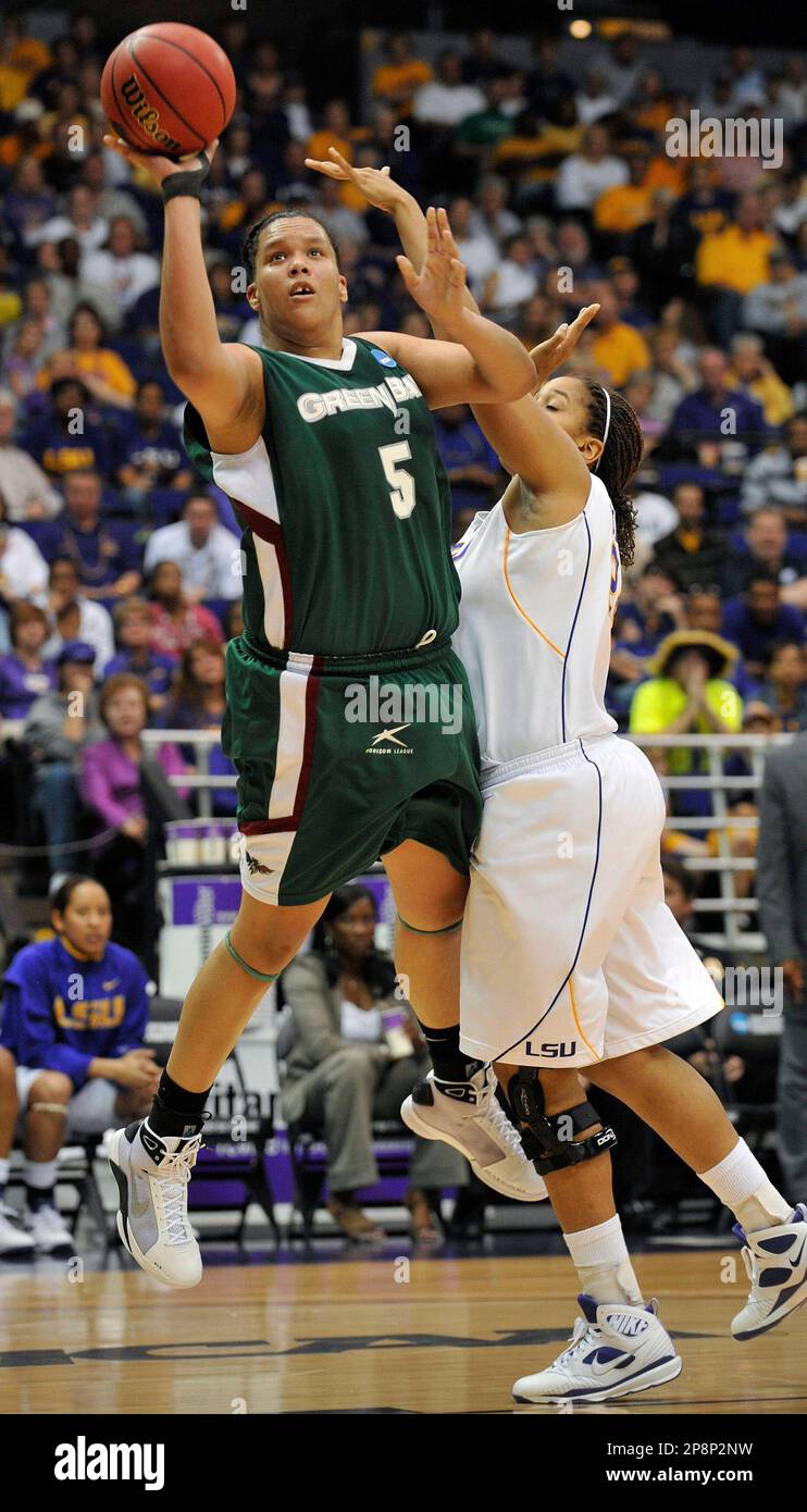 Wisconsin-Green Bay center Lavesa Glover (5) goes to the basket in ...