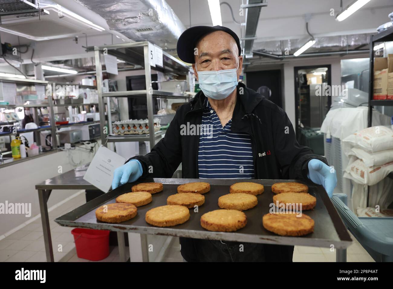 Eighty-year-old chef Peter Tsui Kan-chiu, shows tempeh piece used to ...