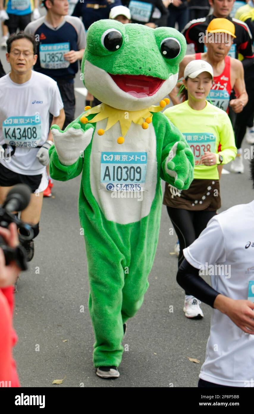 A runner dressed as a frog participates in the Tokyo Marathon in Tokyo ...