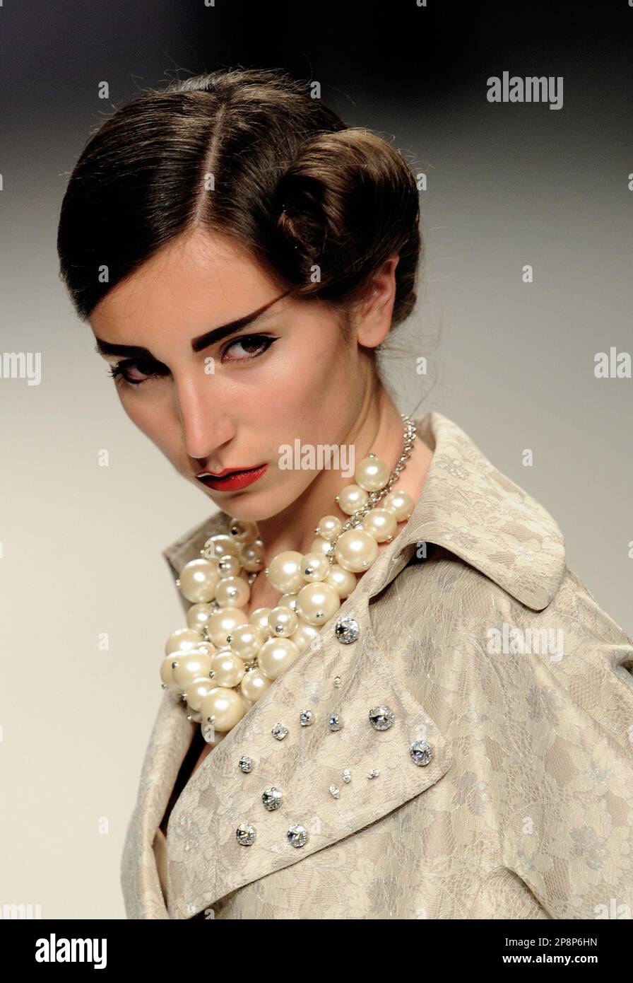 A model displays a creation by Portuguese designer Carlos Gil during ...
