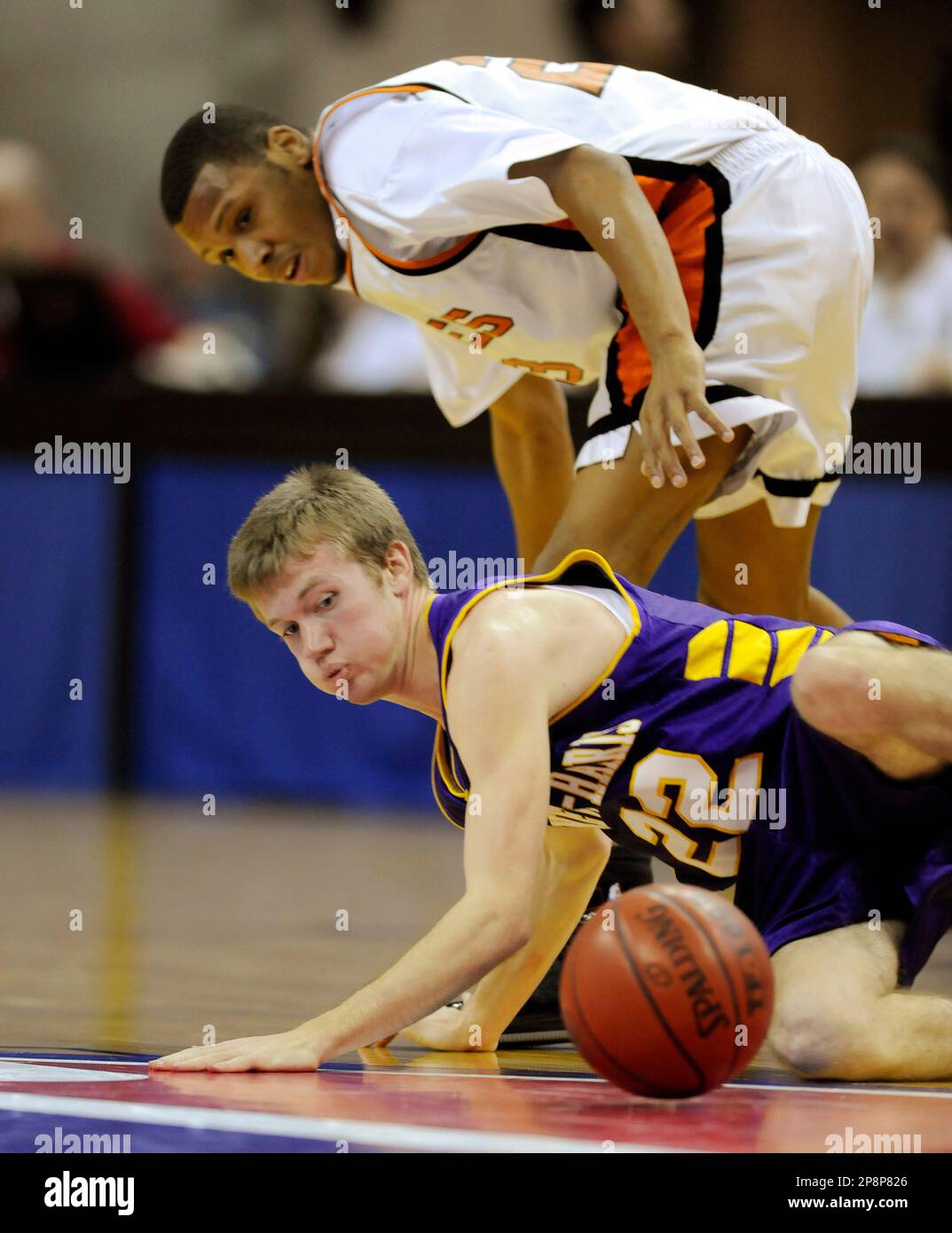 Newton-Harris' Tyler Busick, bottom, falls down as gets tangled up with ...