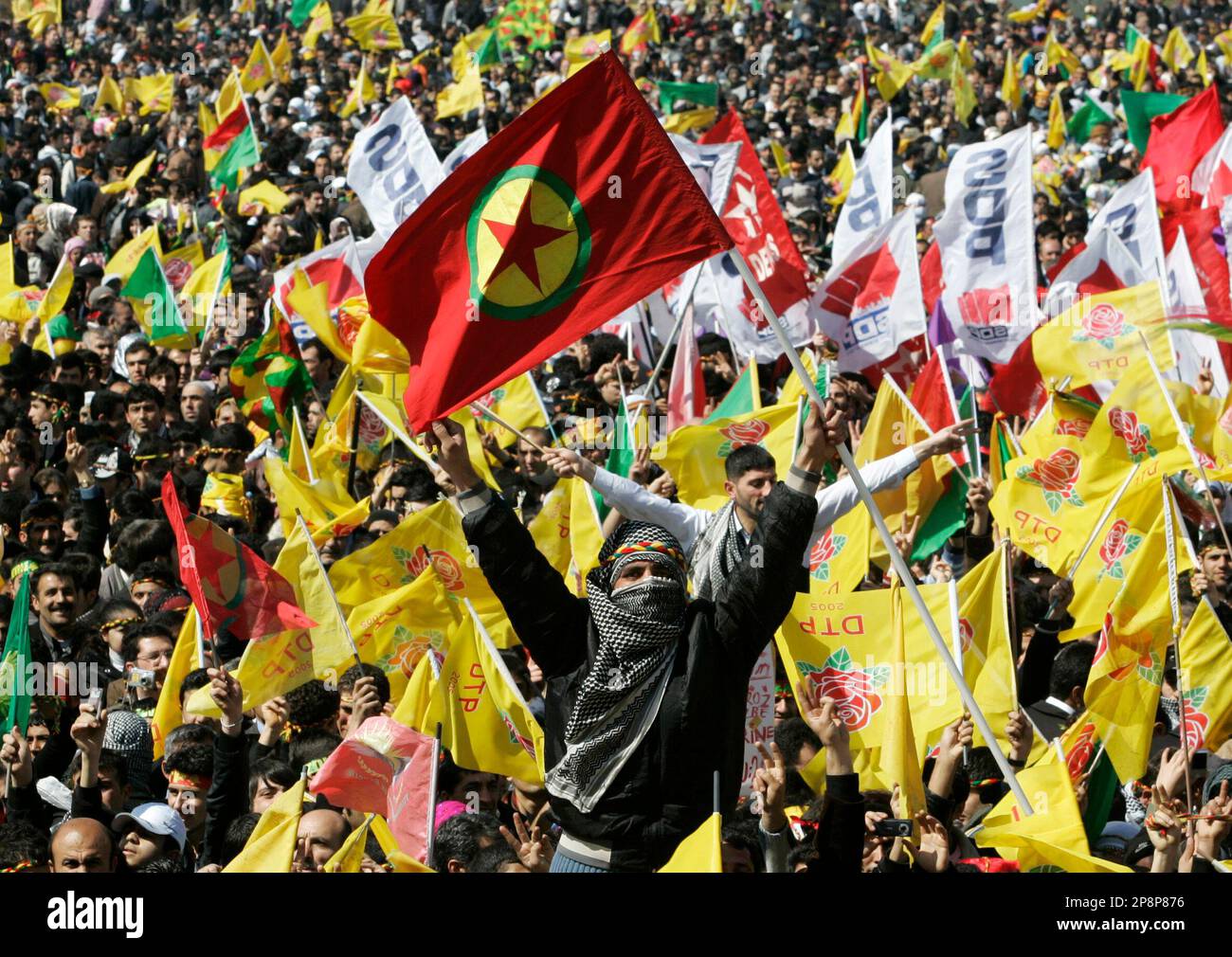 Demonstrators wave flag of the pro-Kurdish People's Democracy Party or ...