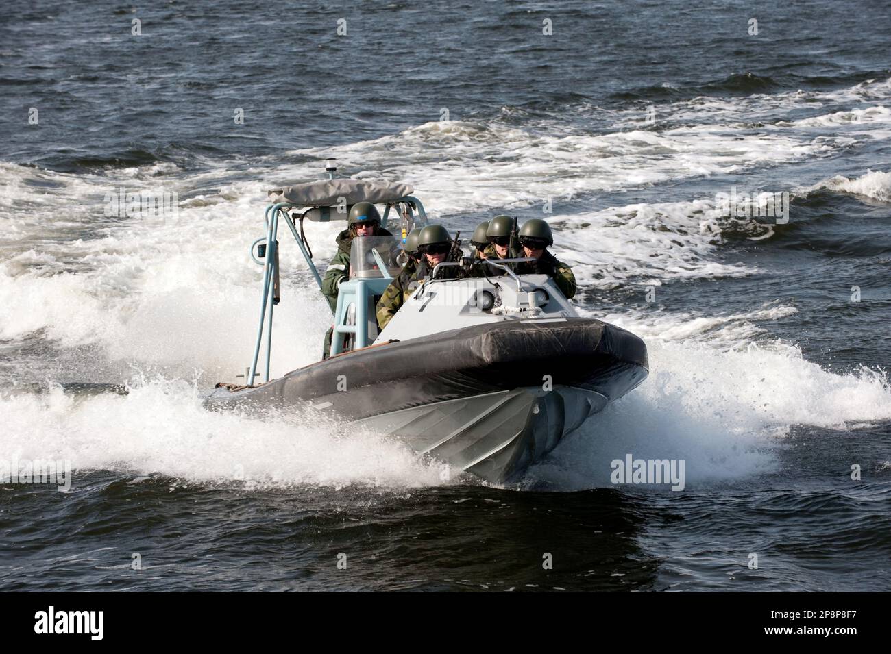 Combat ready soldiers on a speedboat are seen during an exercise for ...