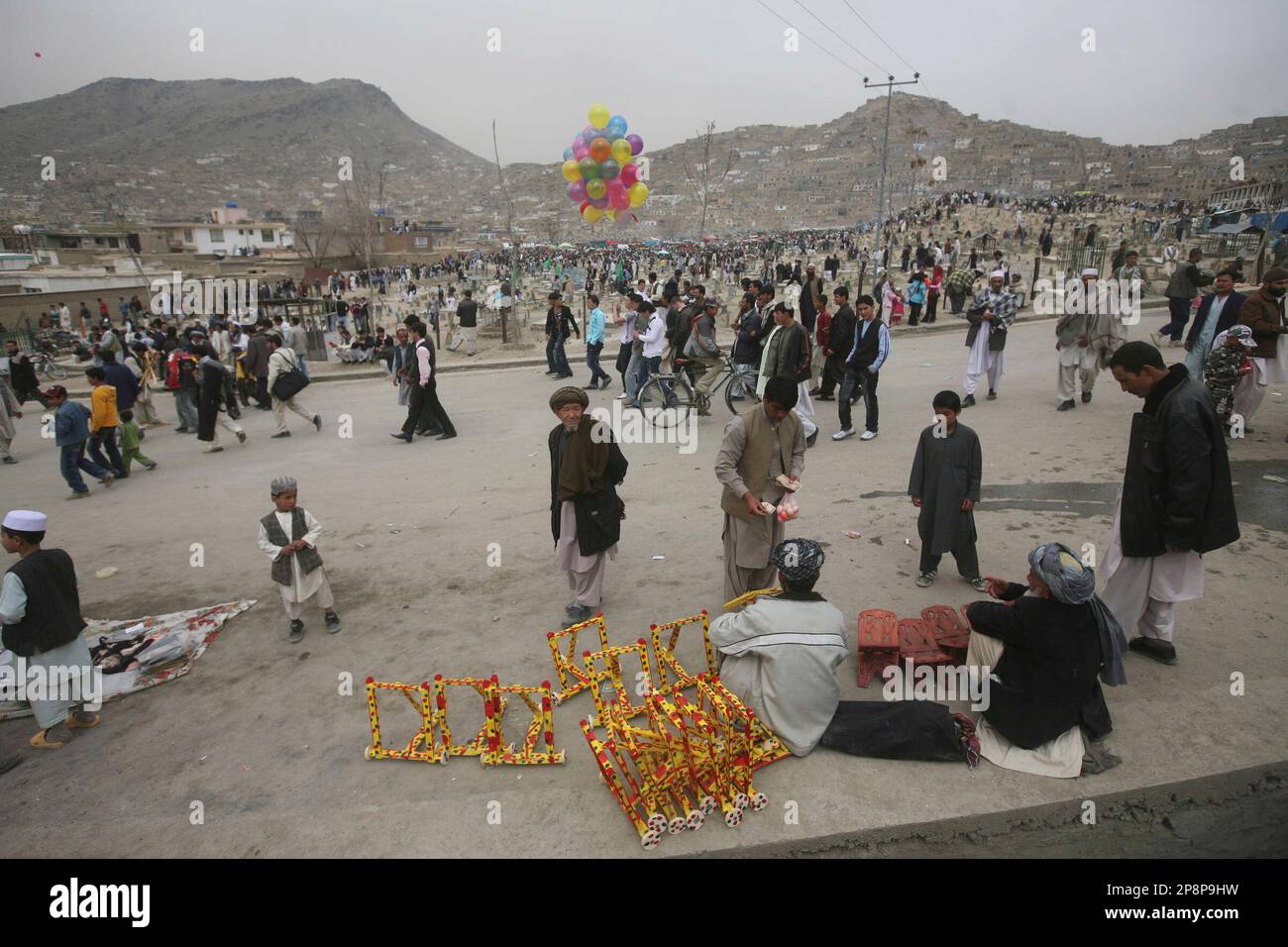Afghan men do some shopping as he and others celebrate the Persian New ...