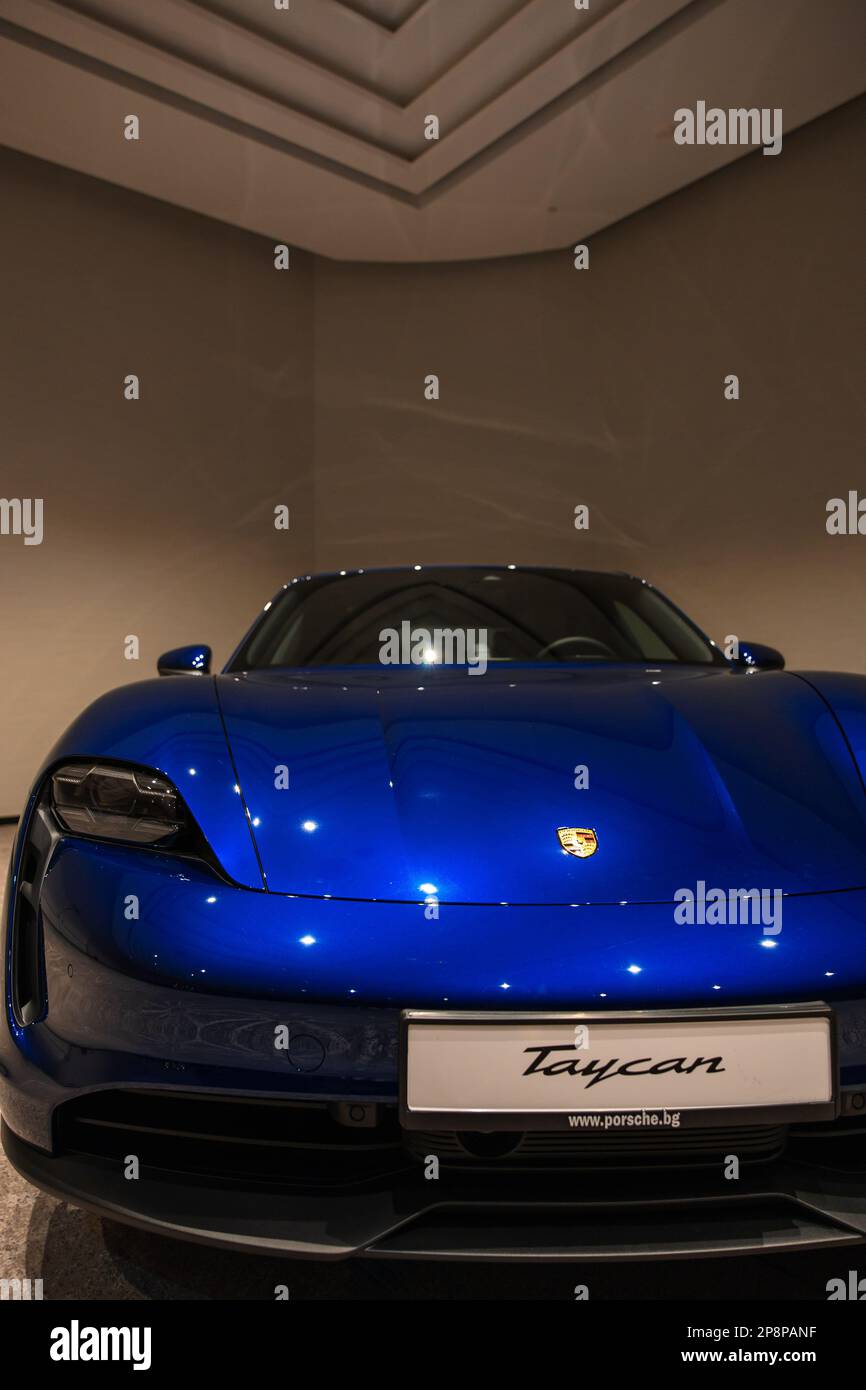 Circa 2023 - Sofia, Bulgaria: A blue shiny new Porsche Tacan car on ...