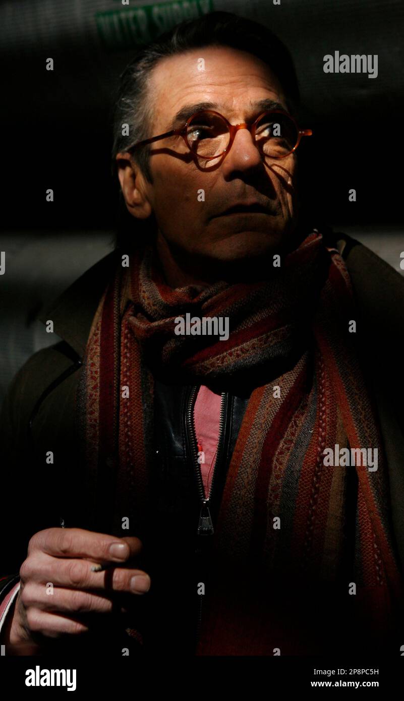 Actor Jeremy Irons poses for a picture in the alley next to the ...