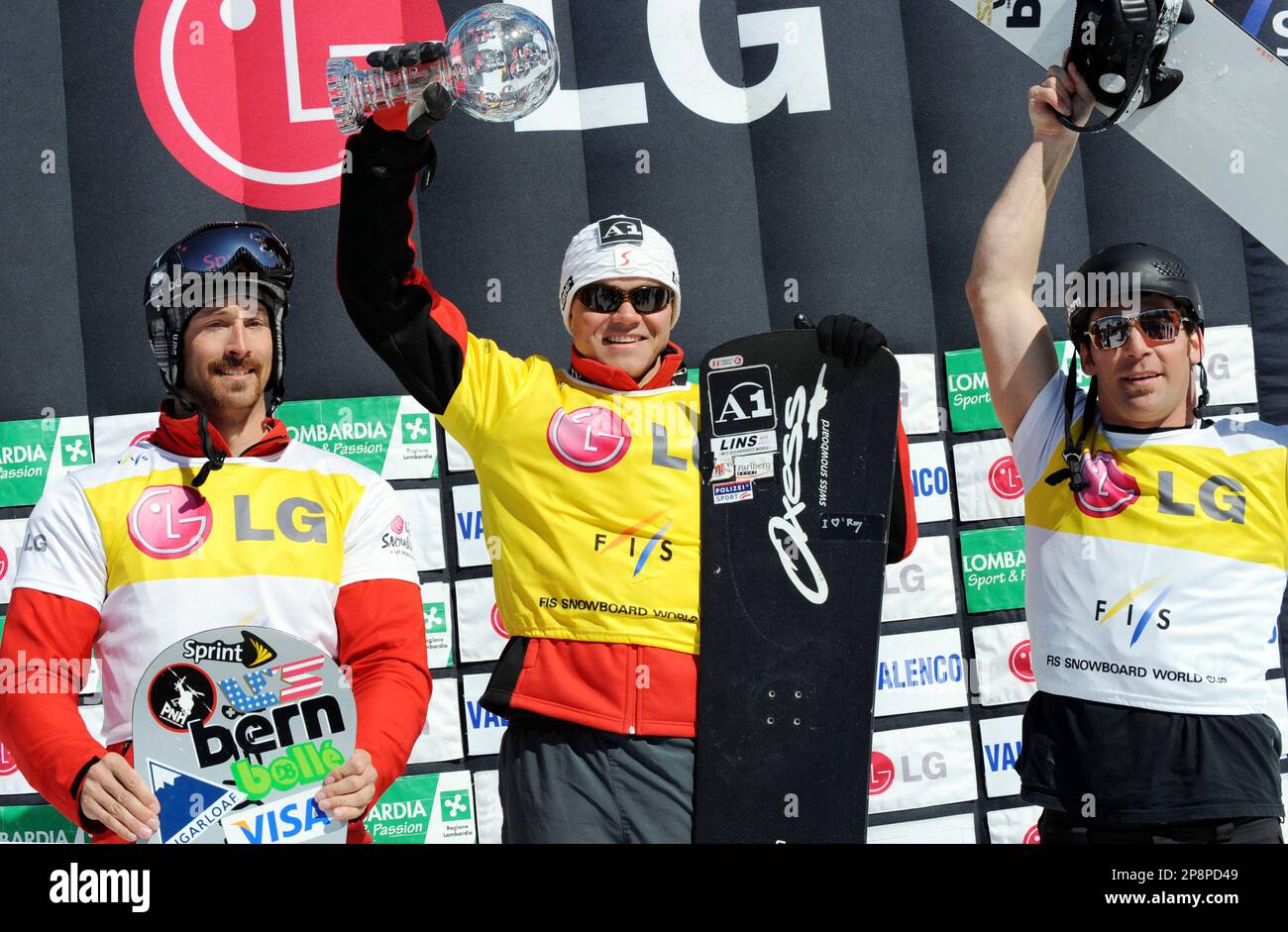 Markus Schairer, of Austria, center, winner of the Men's Snowboard ...