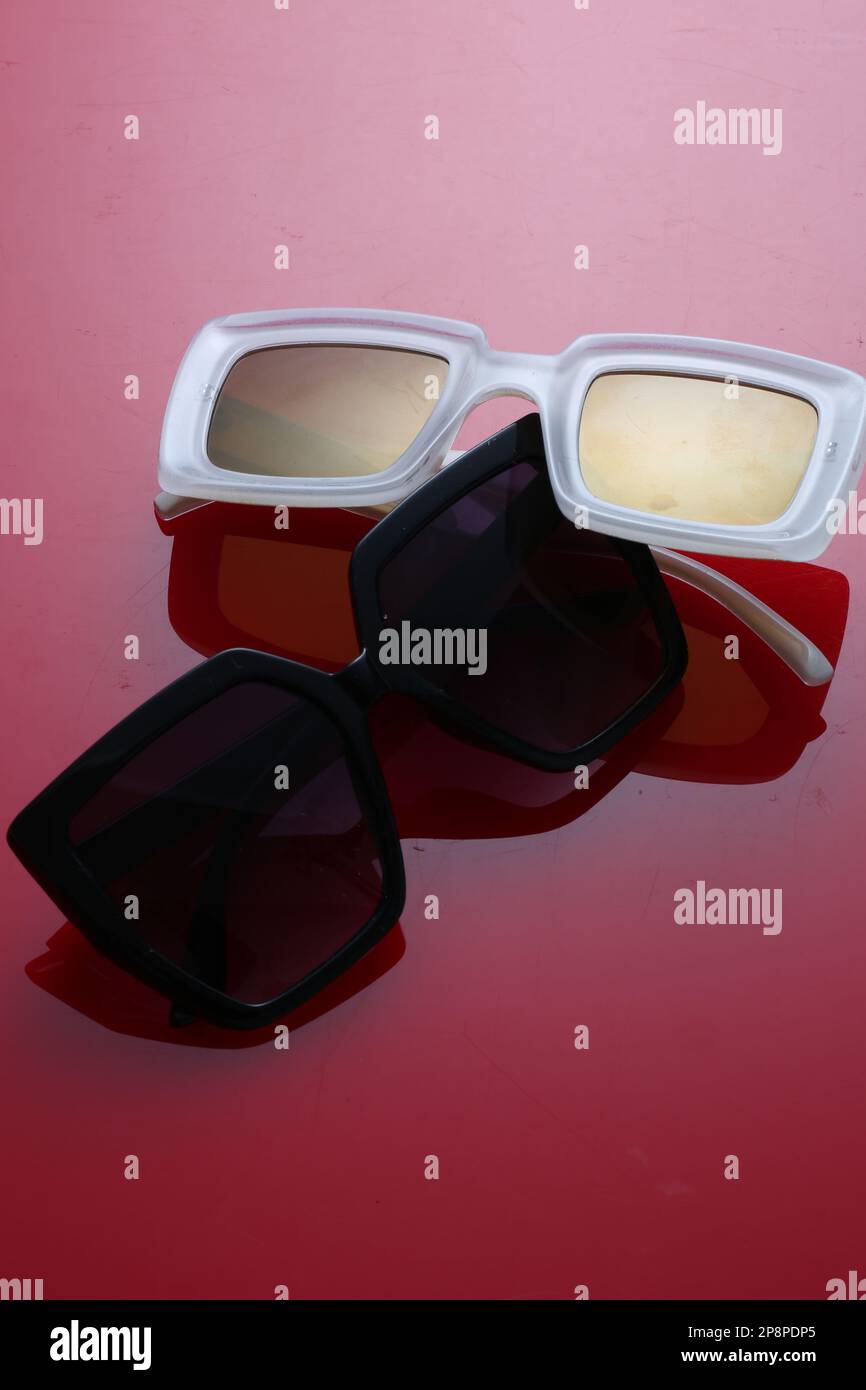 Stack of colourful sunglasses hi-res stock photography and images - Alamy