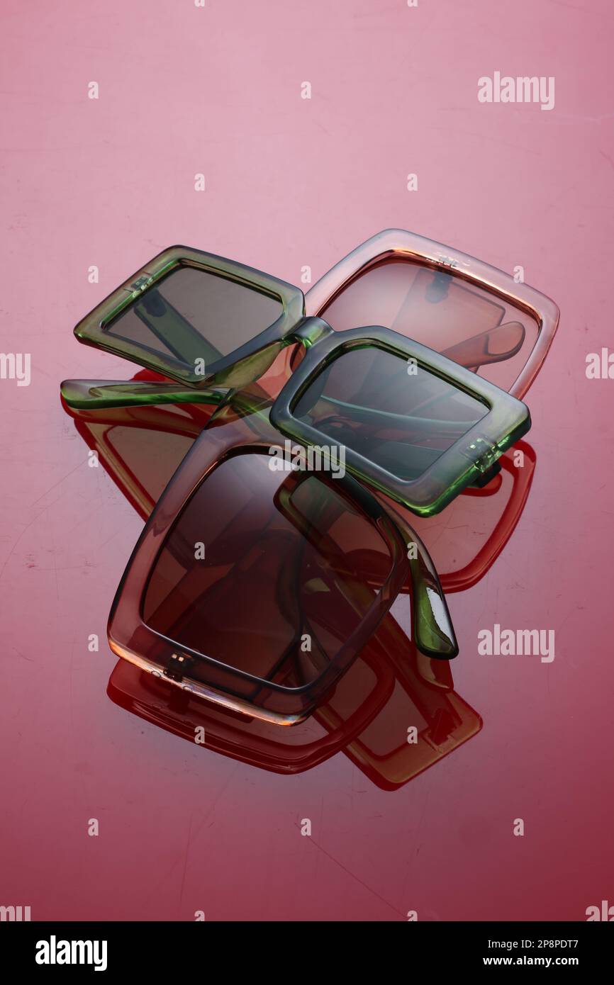 Stack of colourful sunglasses hi-res stock photography and images - Alamy