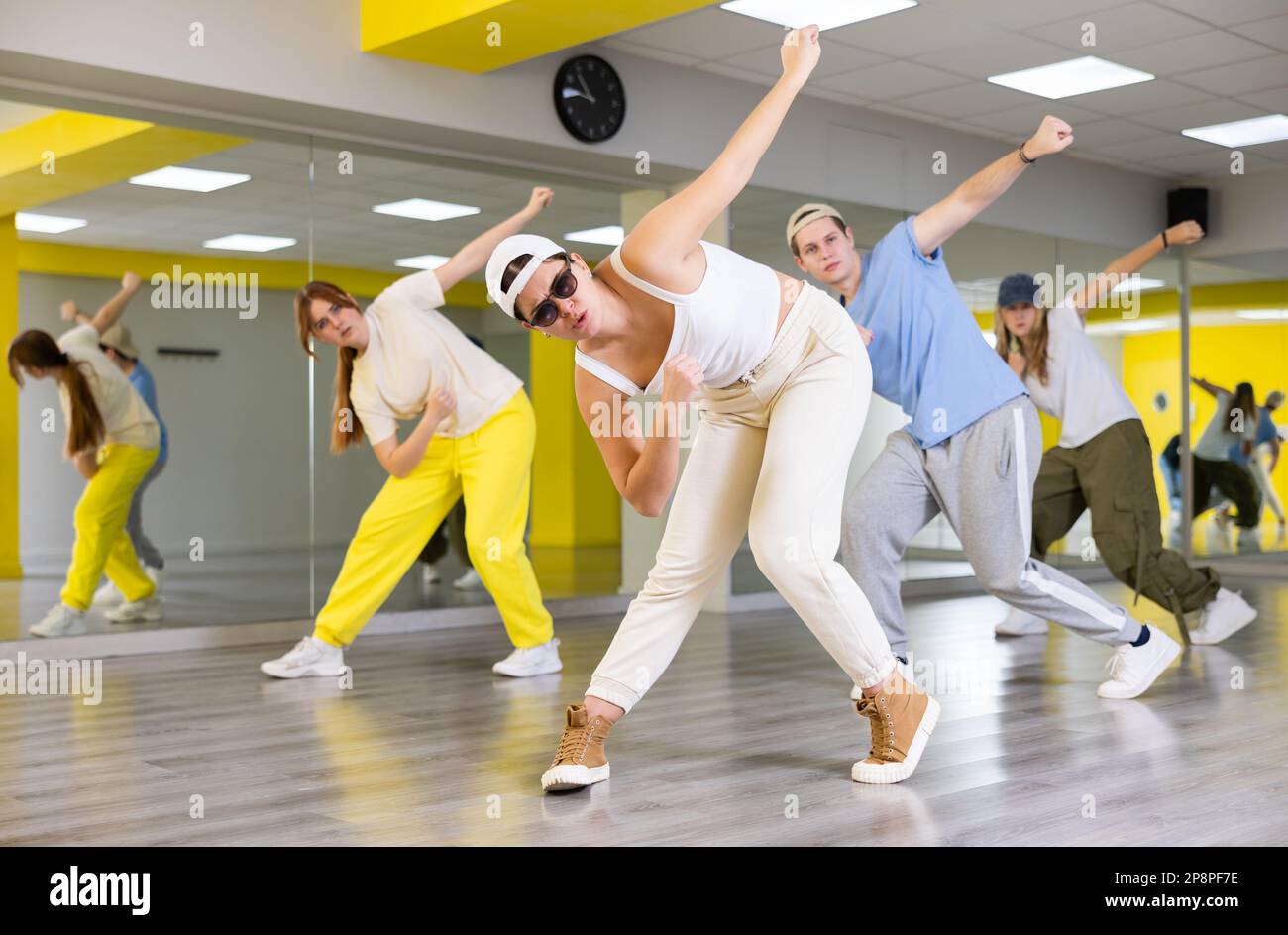 Group of cheerful, talented and active tween dancers forming straight ...