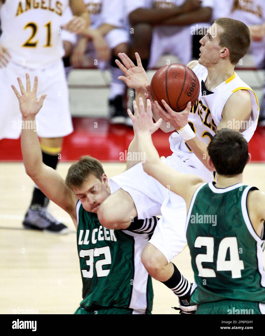 Racine Saint Catherine's Jake Thomas, top, shoots over Fall Creek's ...