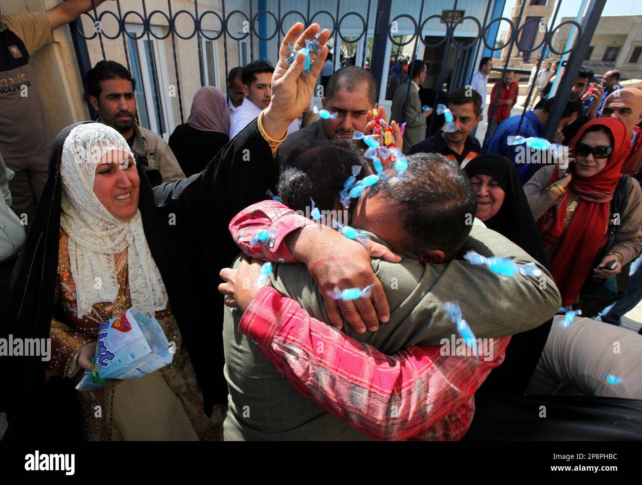Freed Iraqi prisoner Ahmad Hamid, right, is hugged by his brother ...