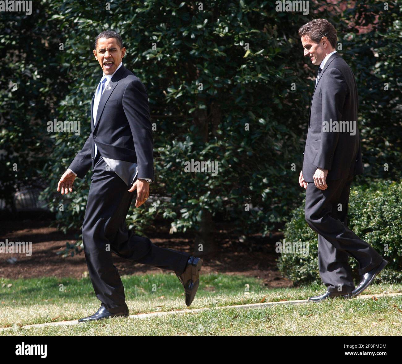 President Barack Obama, followed by Treasury Secretary Timothy Geithner ...