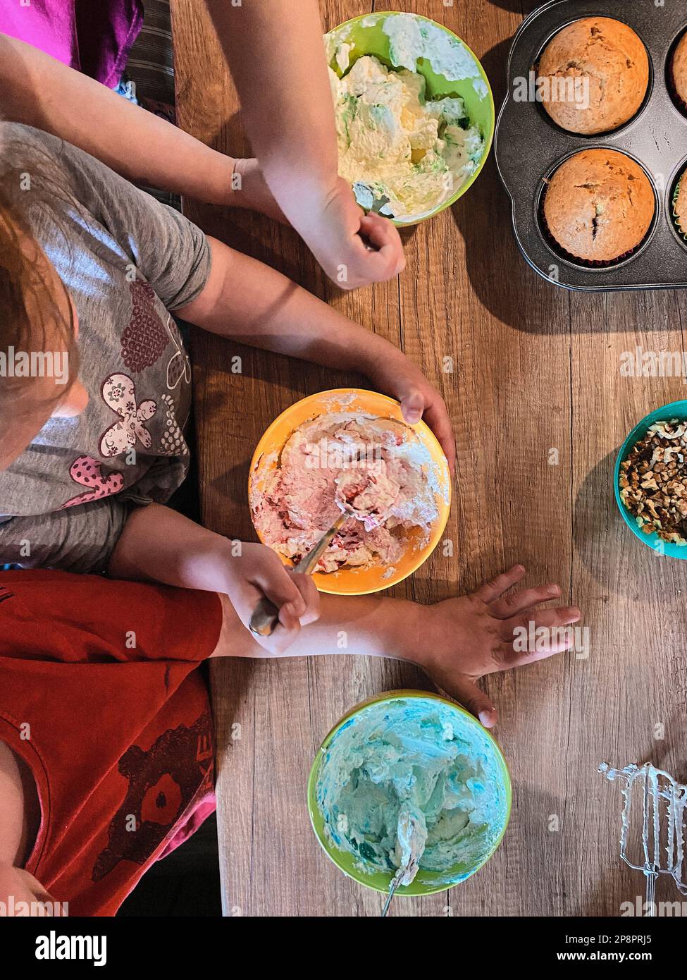 Group of children baking cupcakes, preparing ingredients, toppings ...