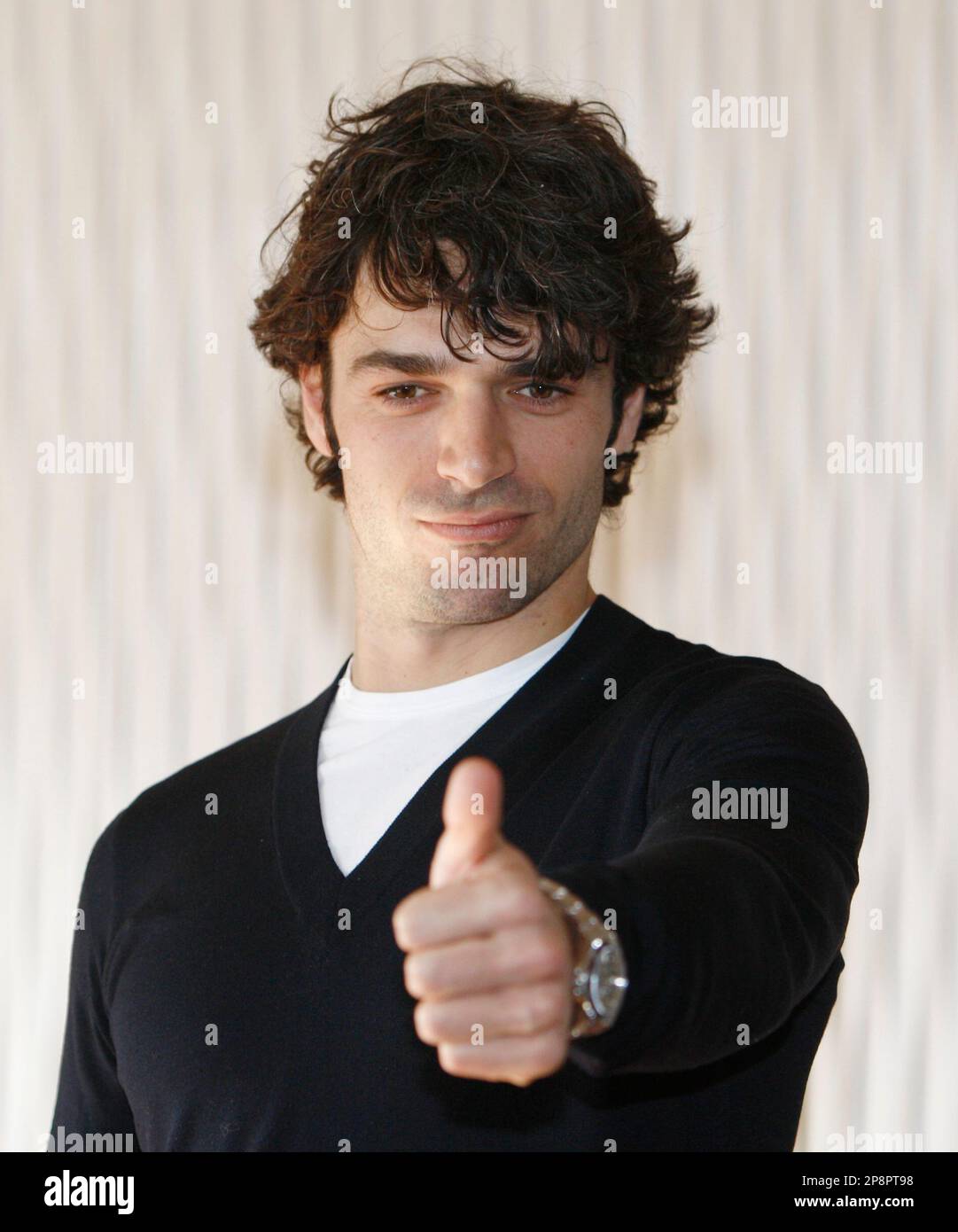 Italian actor Luca Argentero gives a thumbs-up during a photocall of ...