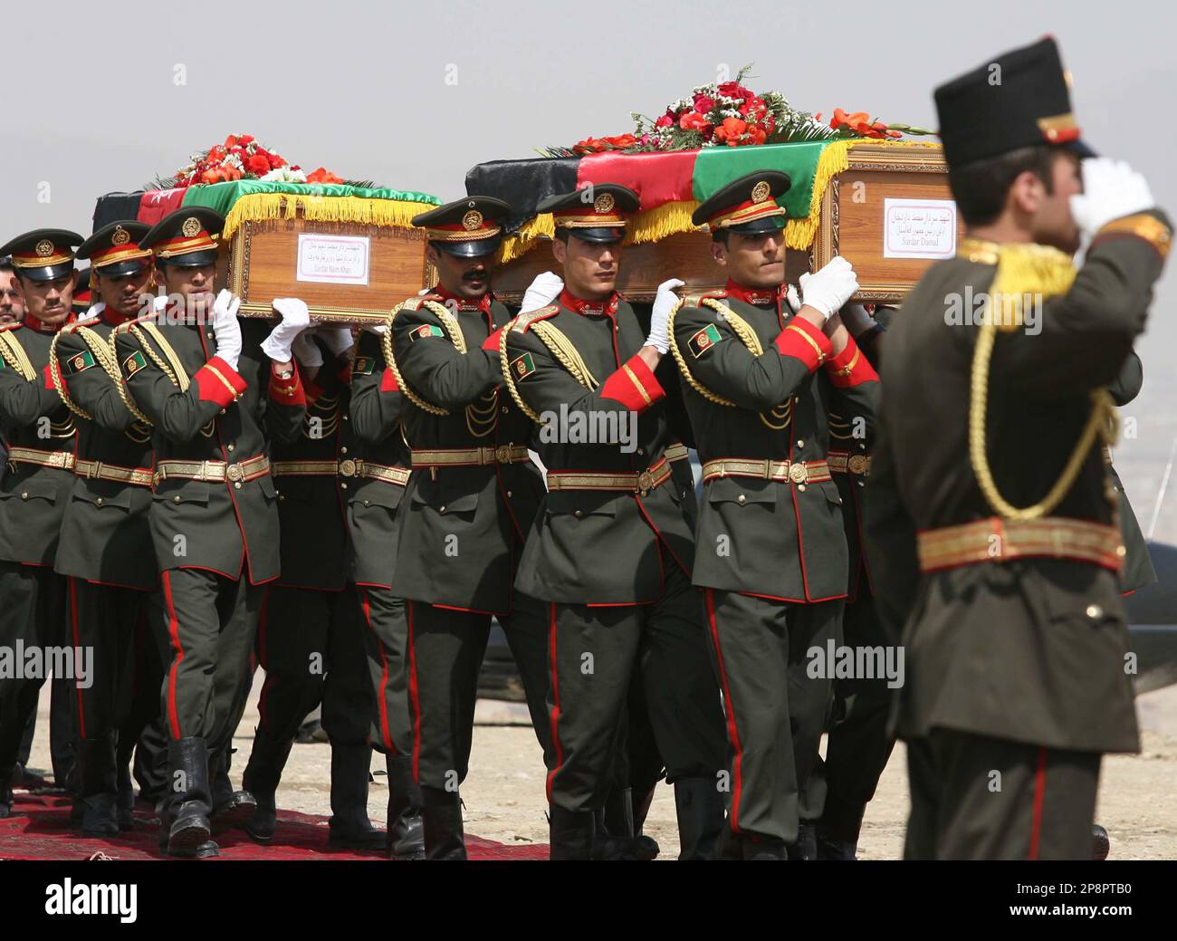 Afghan honor guards carry the coffins of Afghanistans first president ...