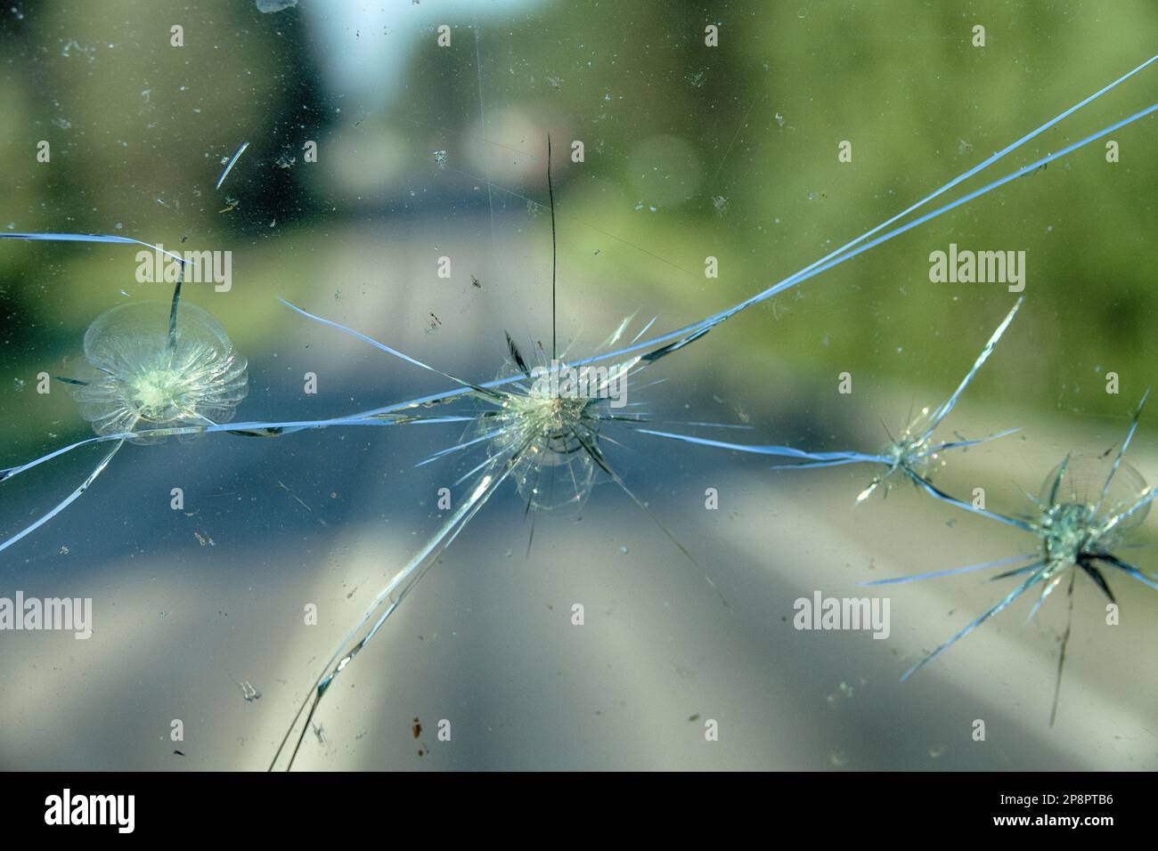 Highway through a broken windshield after encountering a truck with ...
