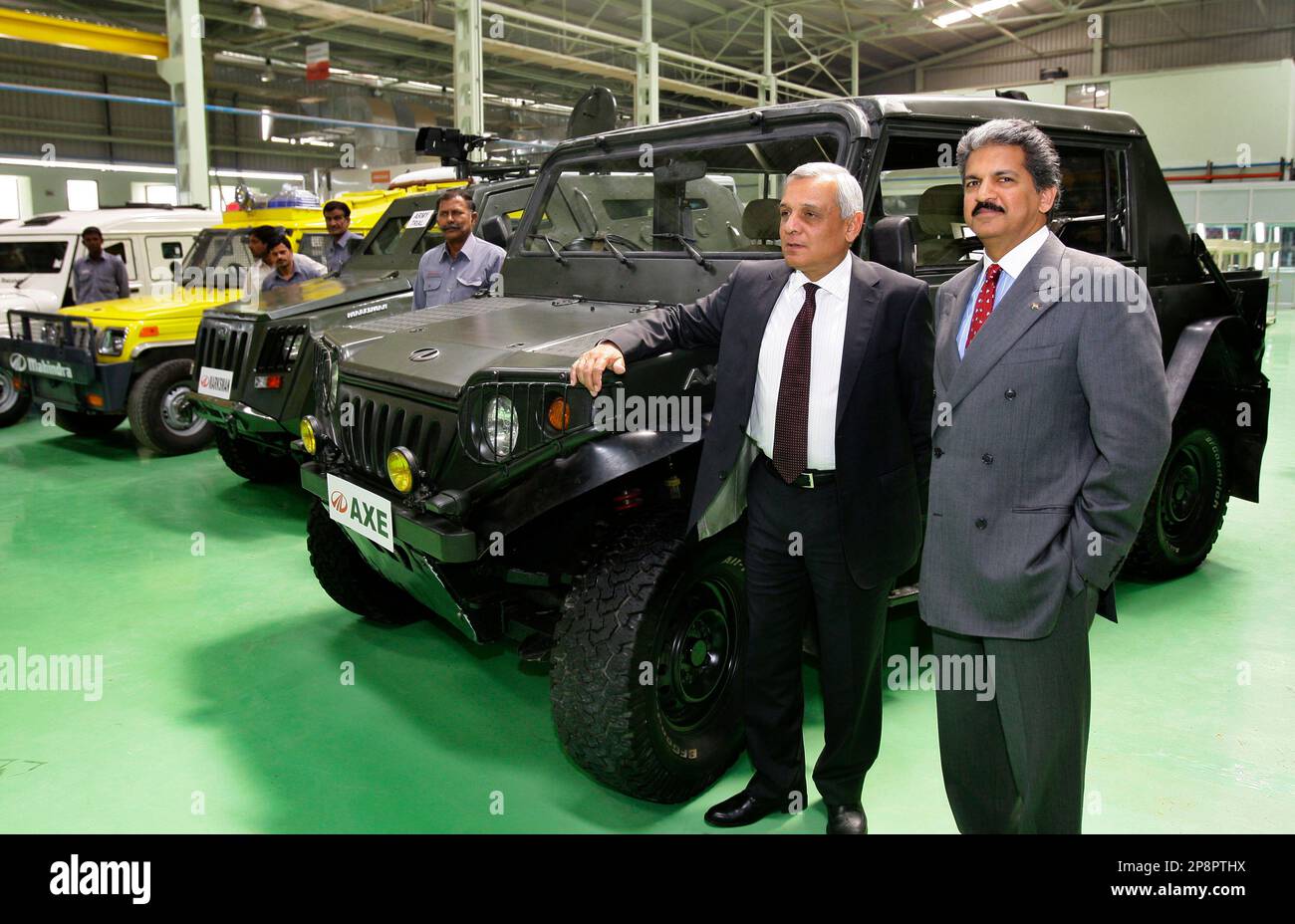 Mahindra Group Managing Director Anand Mahindra, right, and Mahindra ...