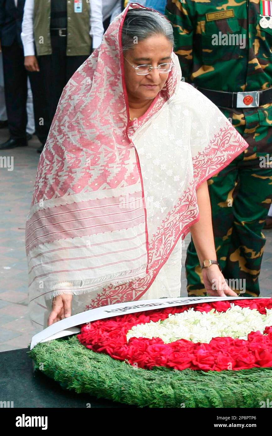 Bangladesh's Prime Minister Sheikh Hasina places a wreath in front of ...