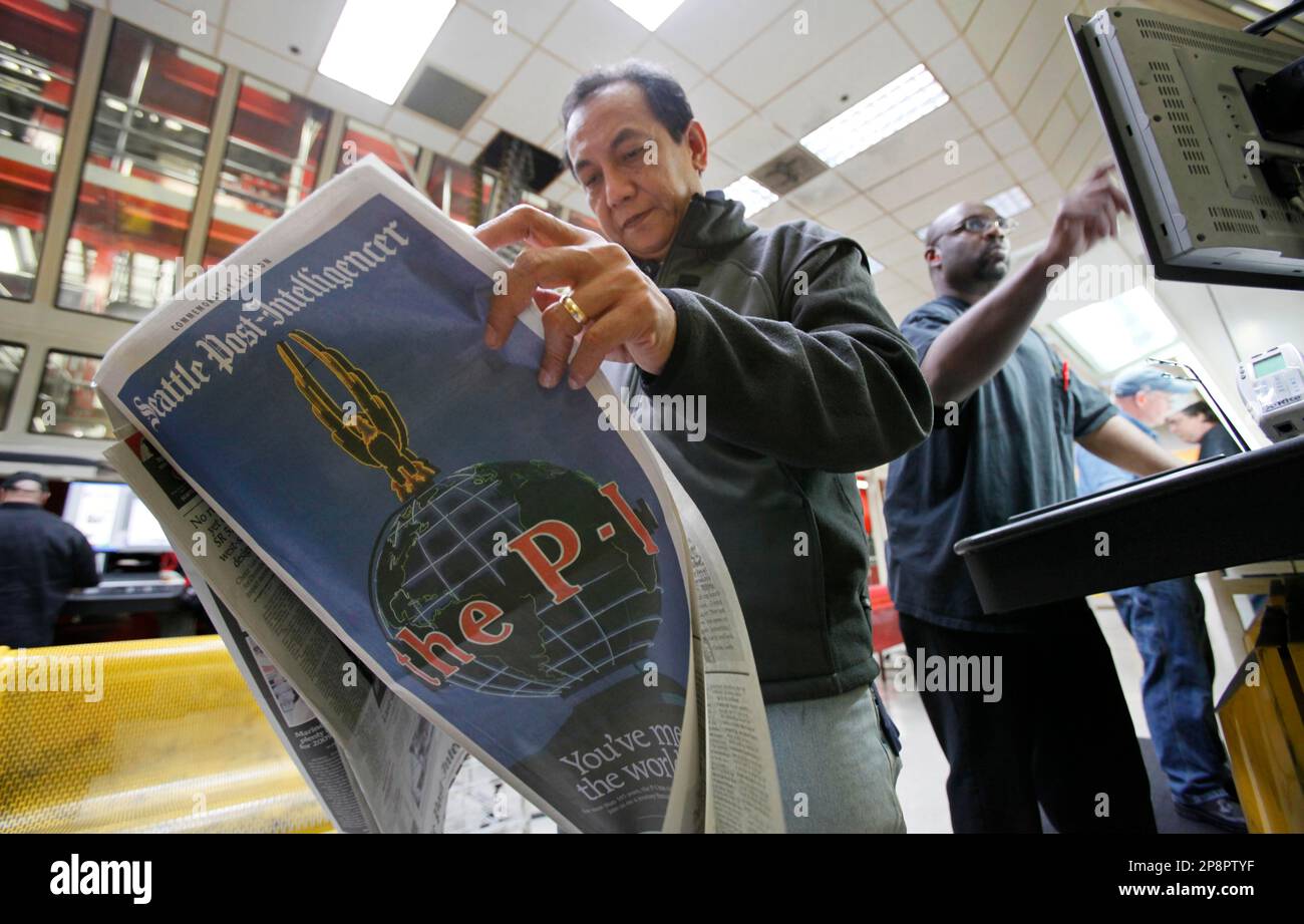 Pressman David Guieb checks the final edition of the Seattle Post ...