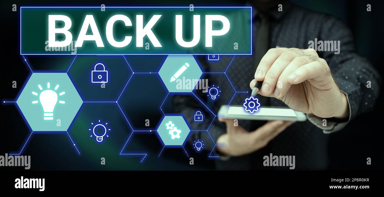 Hand writing sign Back Up. Word Written on saving important data into ...