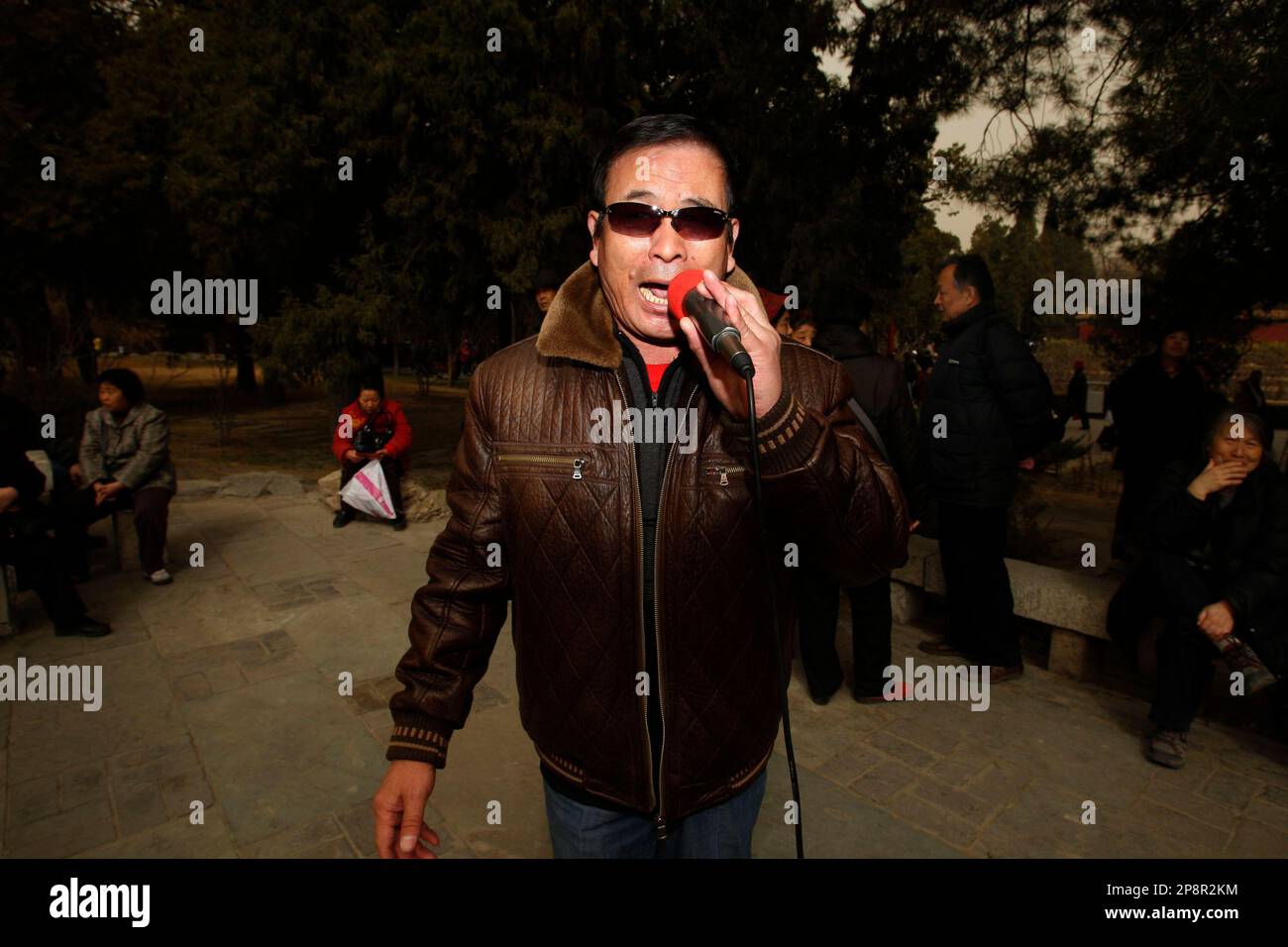 A Chinese man sings folk songs at Coal Mountain Park in Beijing, China ...
