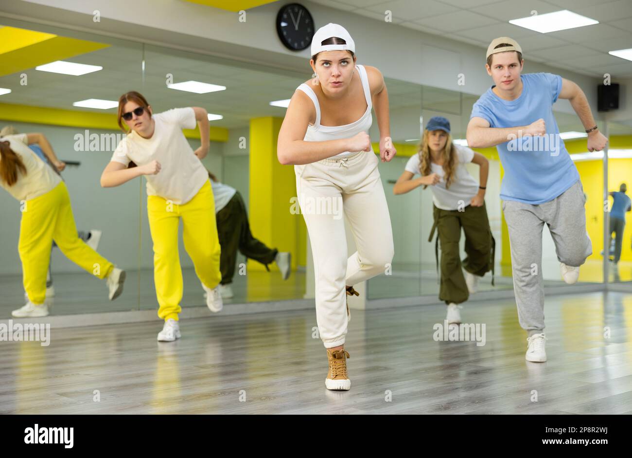 Young girl in cap dancing hip hop Stock Photo - Alamy