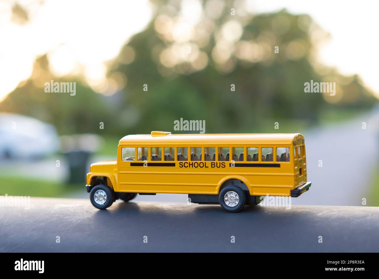 Little model of american yellow school bus outdoor. Concept of ...